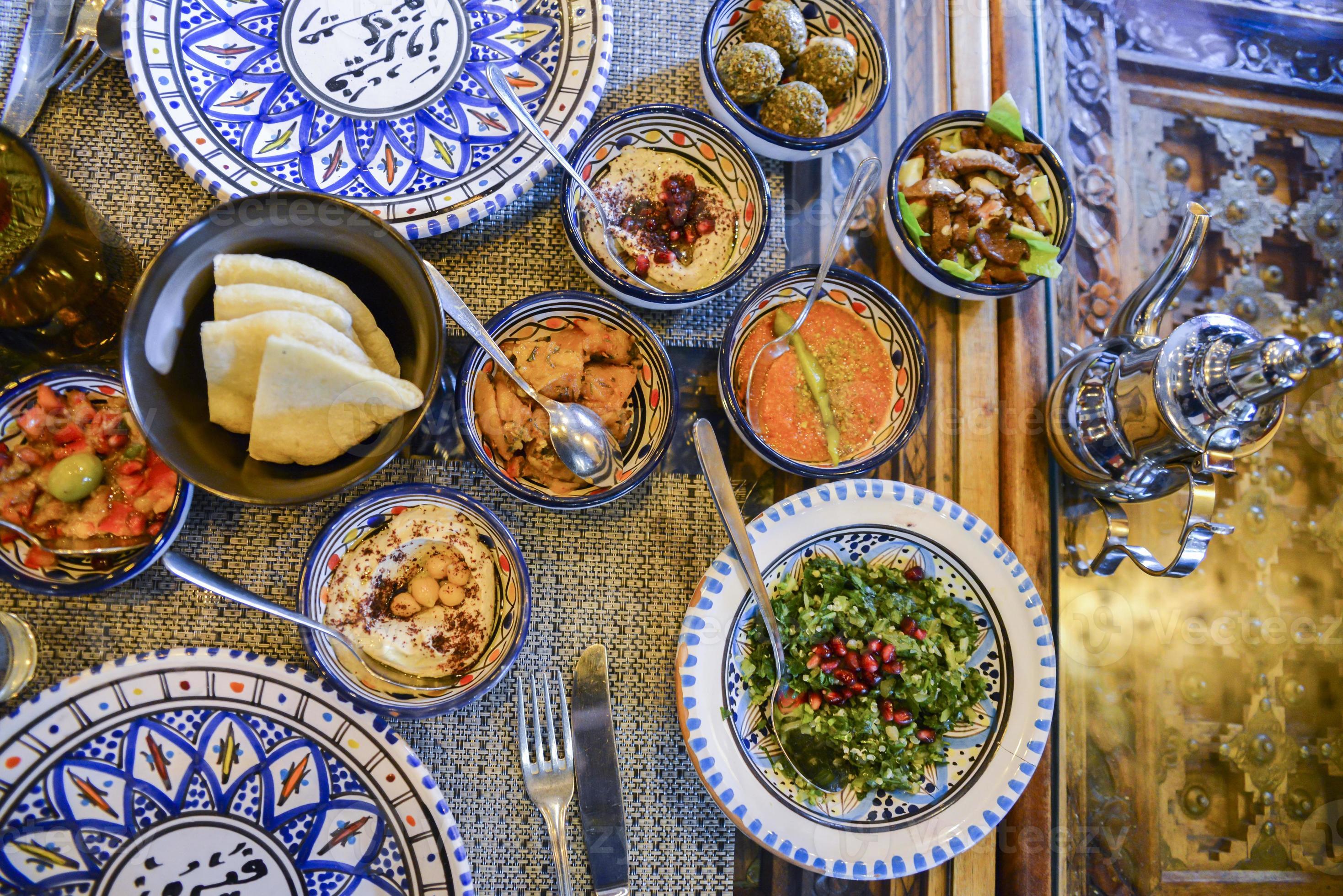 Middle eastern or arabic dishes and assorted meze, concrete rustic ...