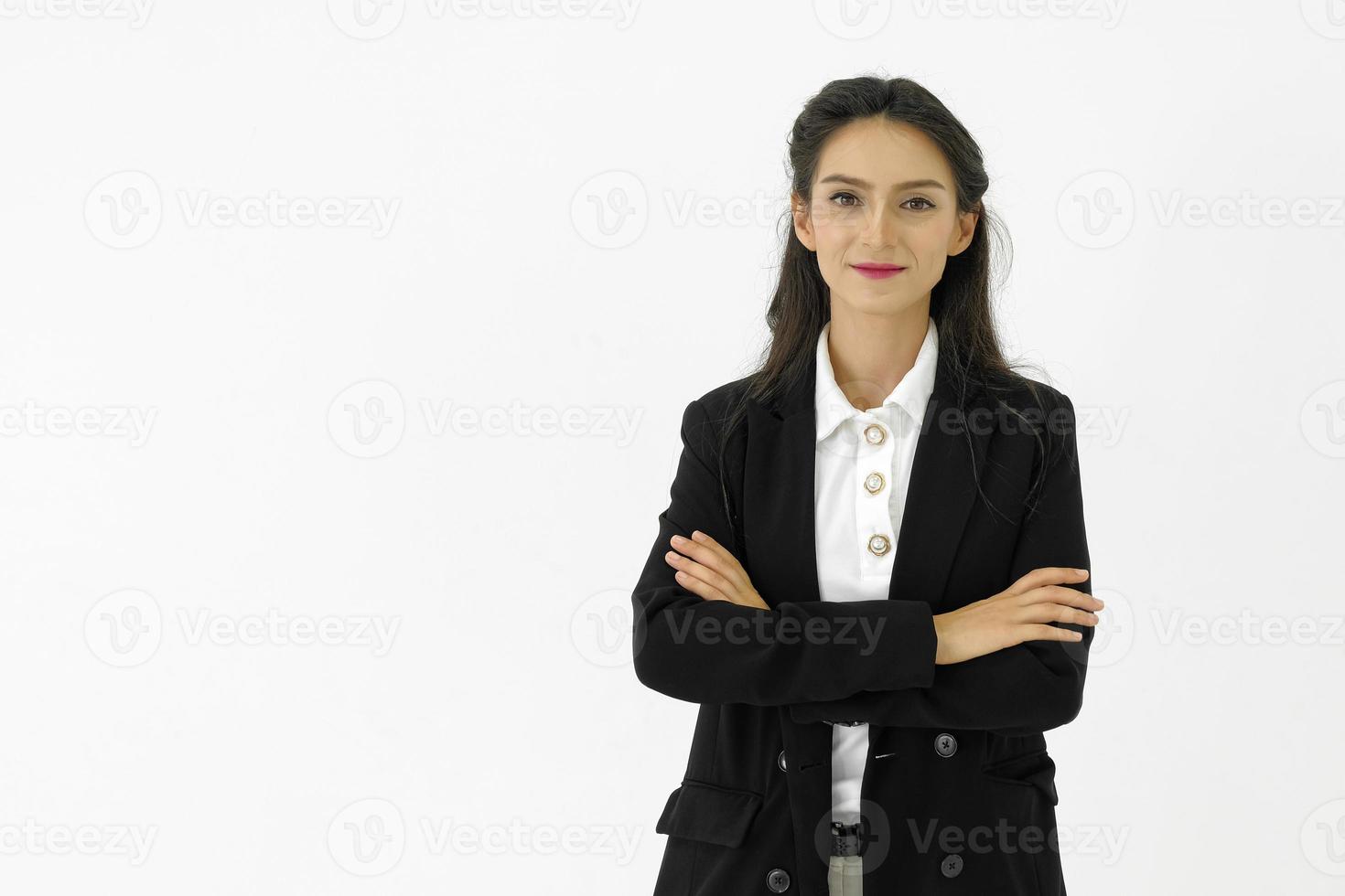 Smiling confident young business woman standing arms crossed on white ...