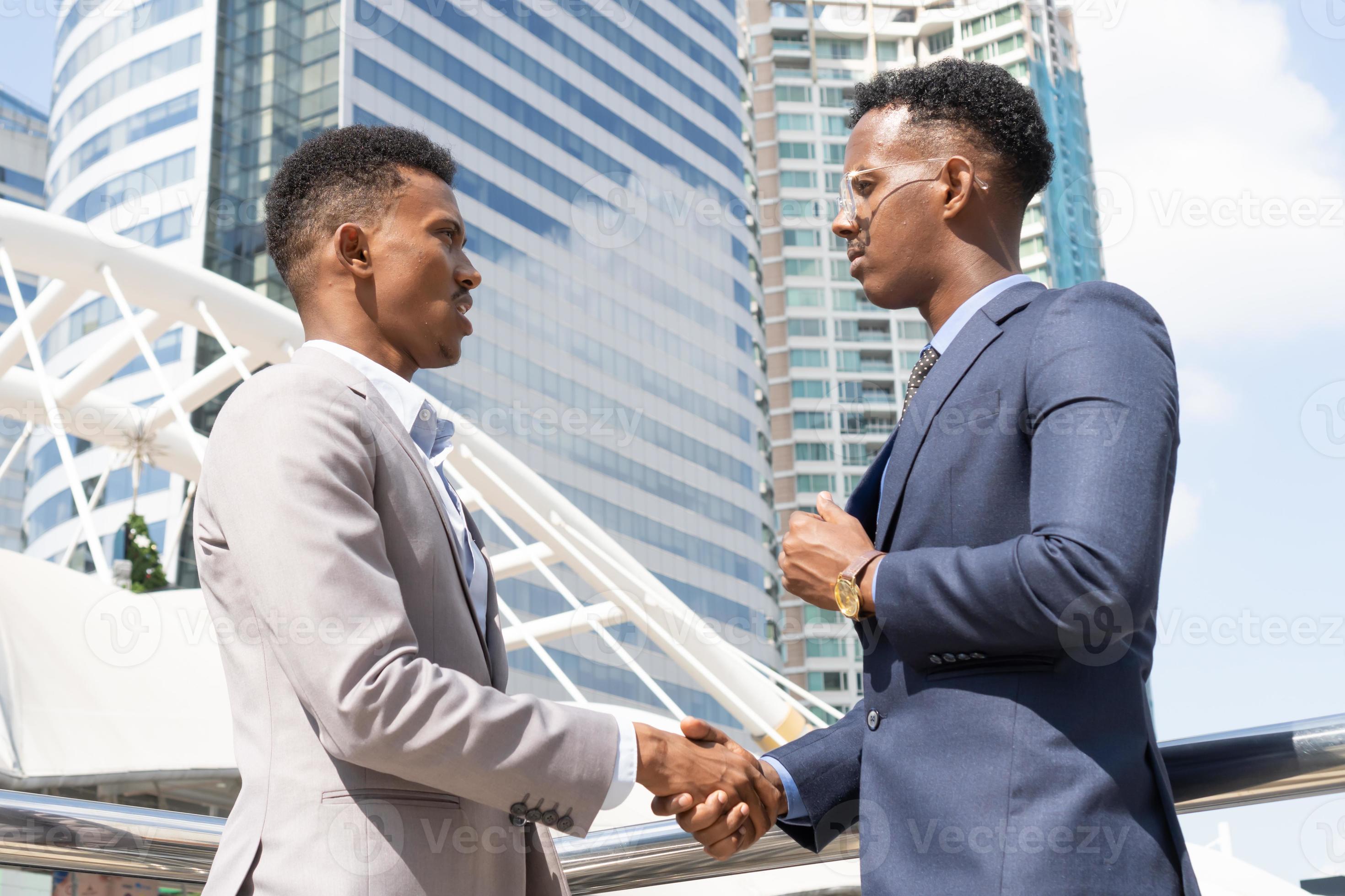 Welcome to our team. young modern men in smart casual wear shaking ... Welcome to our team. young modern men in smart casual wear shaking ...