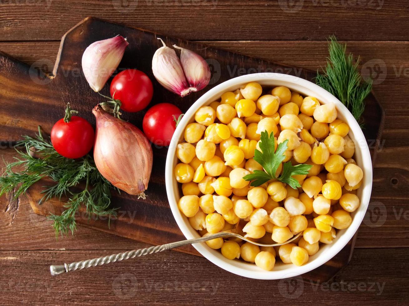 Cooked Chickpeas on bowl on dark wooden table. Healthy, vegetarian ...