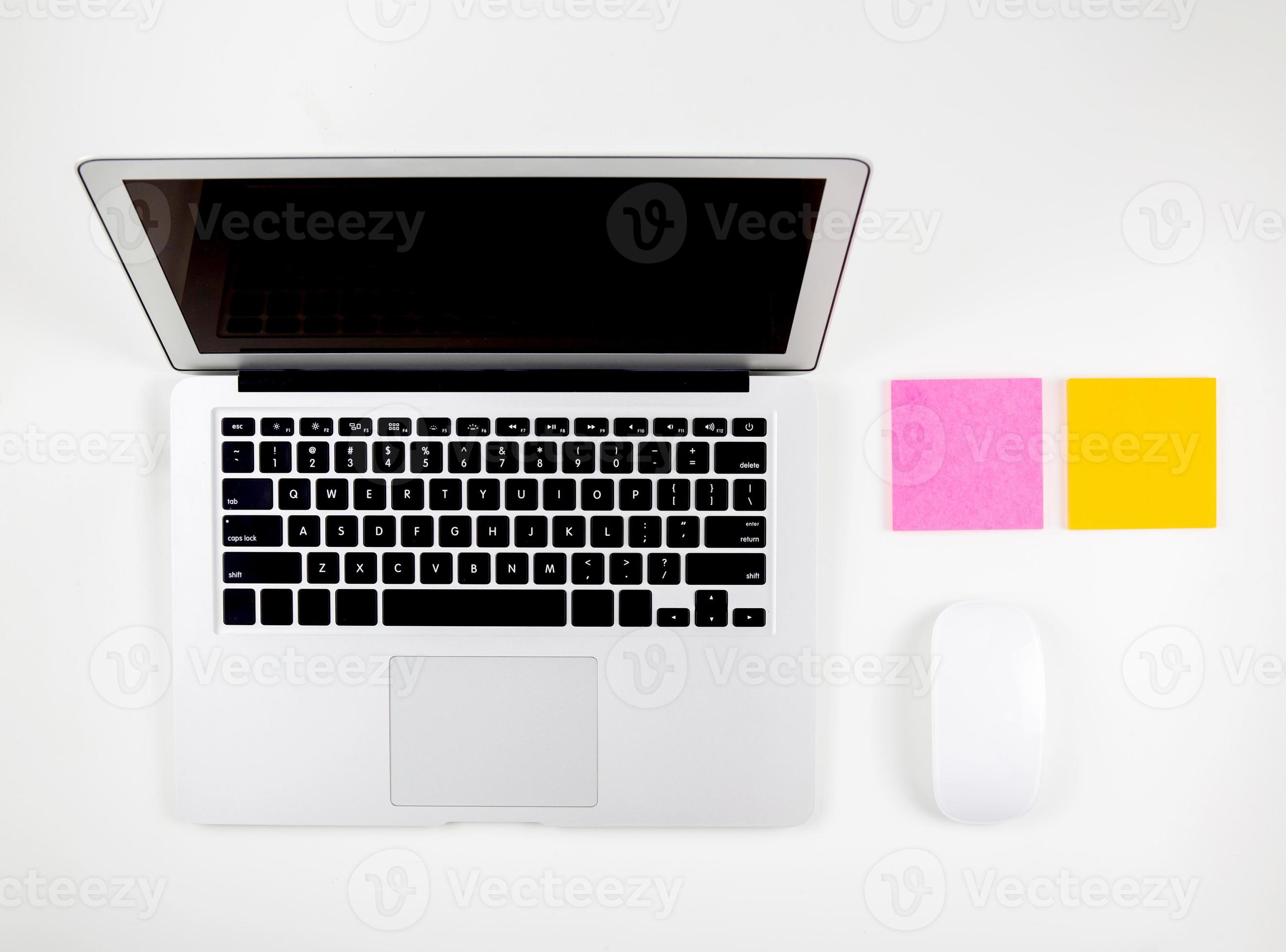 Top view of laptop computer with open display screen monitor, mouse and ...