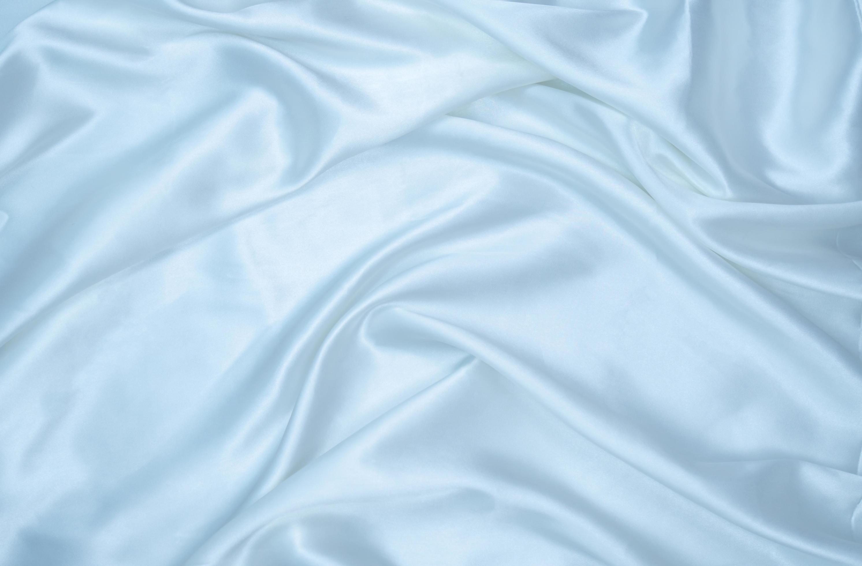 White smooth satin or silk texture background. Elegant cloth material ...
