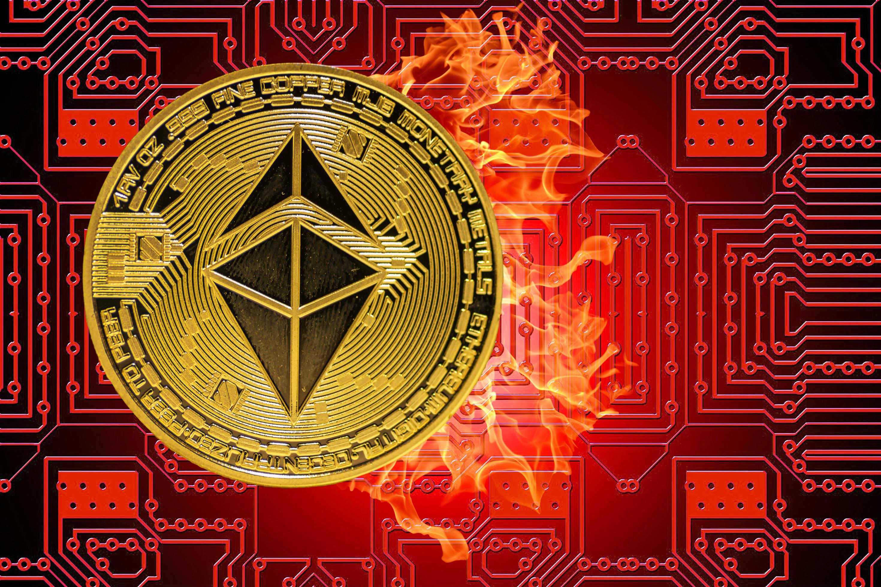 burning golden valueable single ether coin from ethereum crypto currency with a red board in the ...