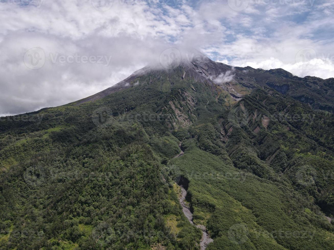 Aerial view of active Merapi mountain with clear sky in Indonesia ...