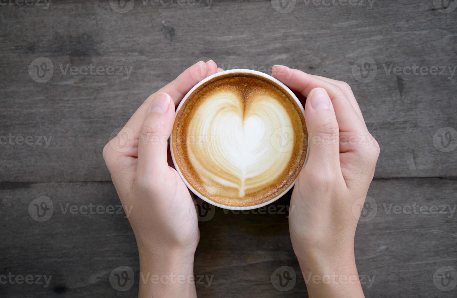 woman hands holding Latte art, coffee cup 8031299 Stock Photo at Vecteezy