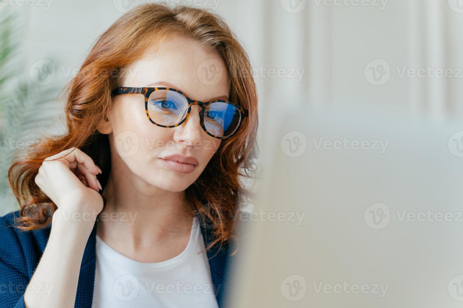 Close up shot of focused female worker completes successful project ... Close up shot of focused female worker completes successful project ...