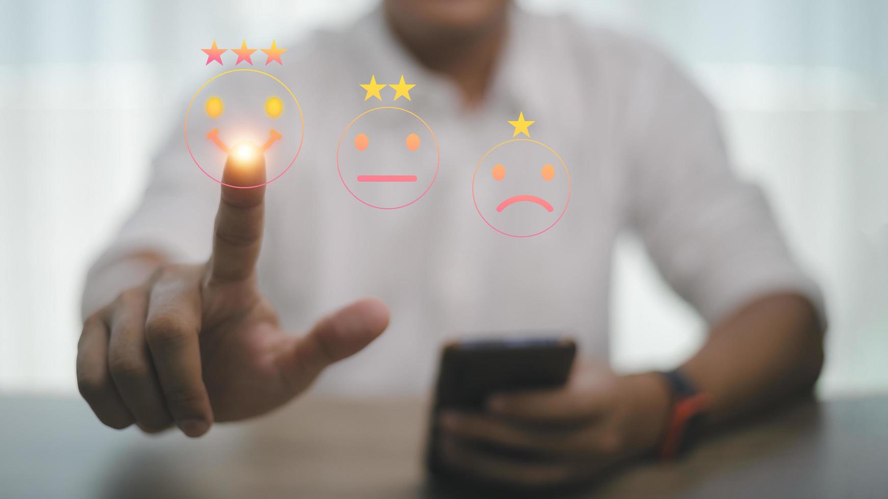 Businessman pressing smiley face emoticon on virtual touch screen ...