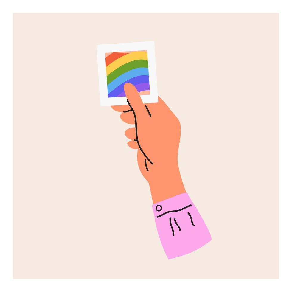 A hand holds an LGBT photo. Pride month, LGBT flag, rainbow. Flat ...