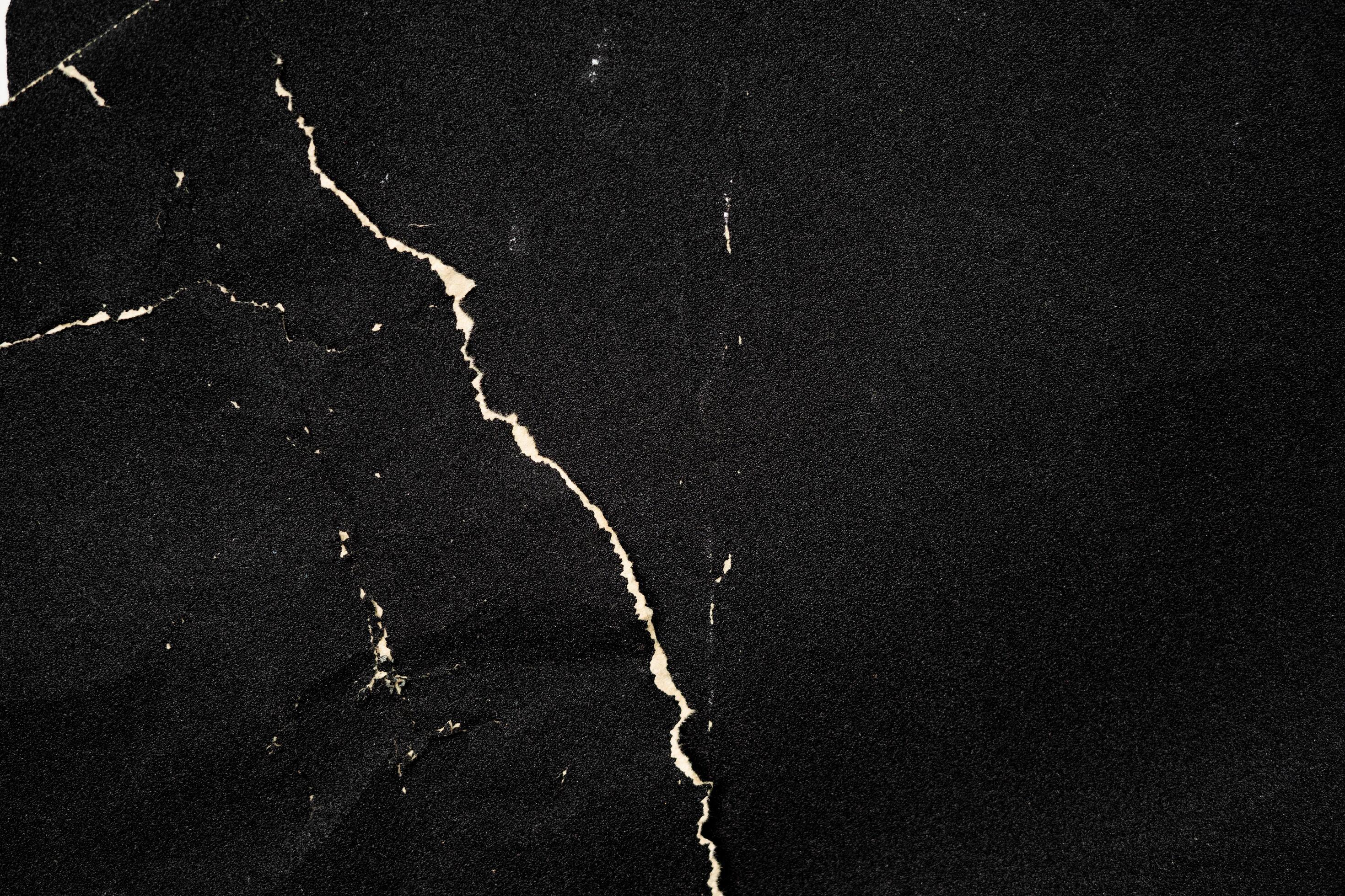 Crumpled black paper with a detailed texture. Close up the paper with ... Crumpled black paper with a detailed texture. Close up the paper with ...