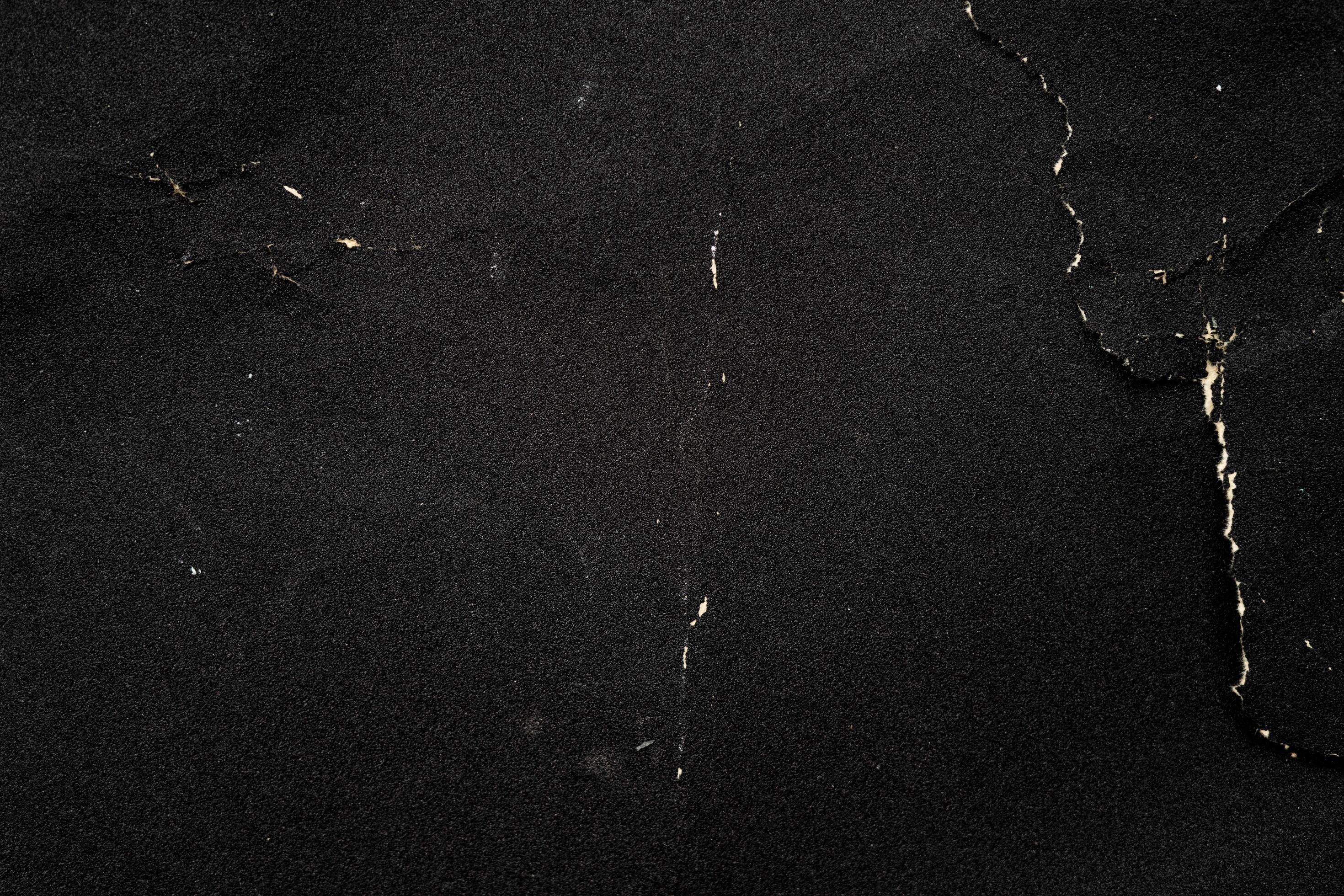 Crumpled black paper with a detailed texture. Close up the paper with ... Crumpled black paper with a detailed texture. Close up the paper with ...