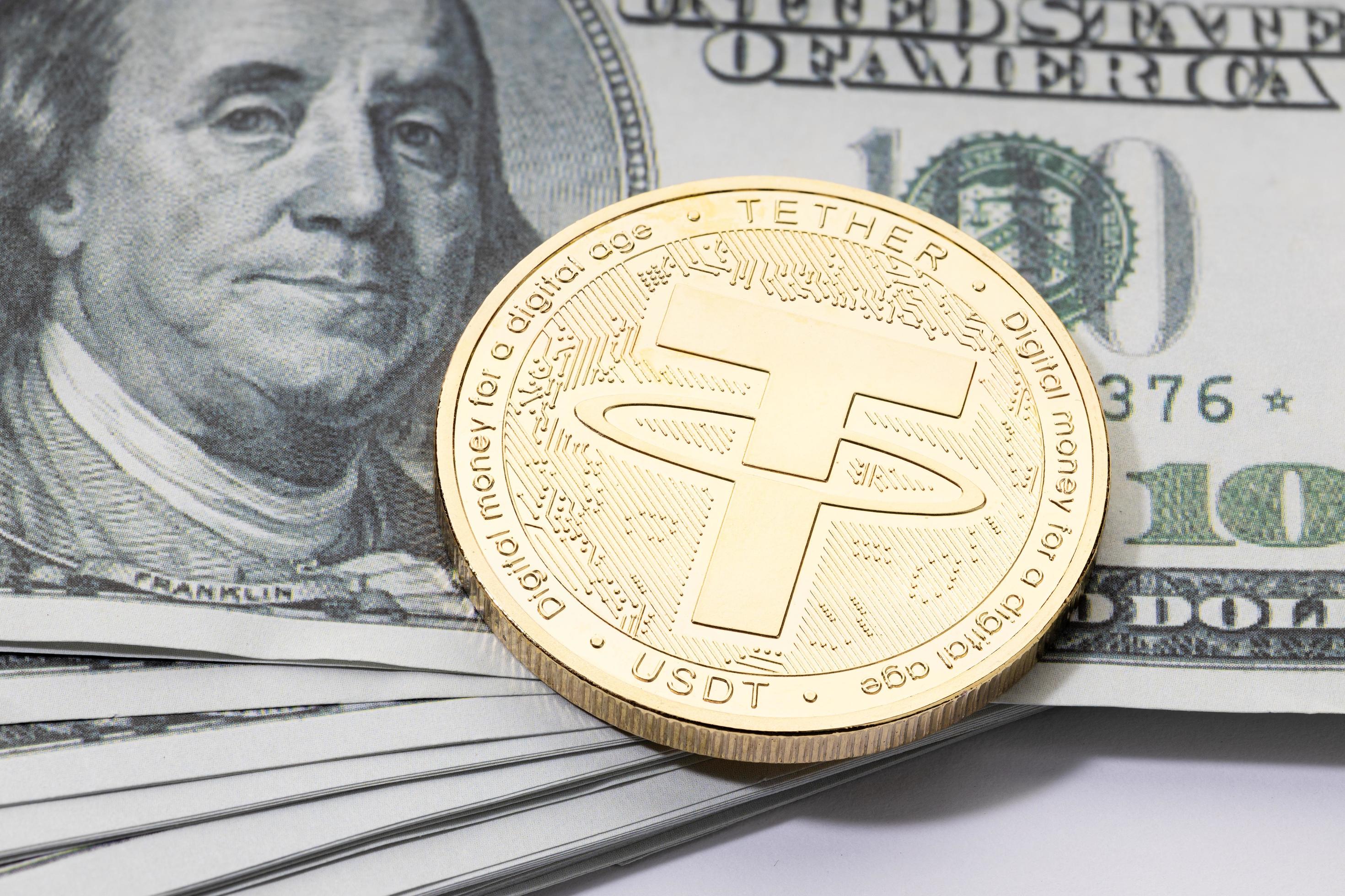 Tether USDT Coin On Stacked Dollar Banknotes USDT Dollar Parity tether-usdt-coin-on-stacked-dollar-banknotes-usdt-dollar-parity