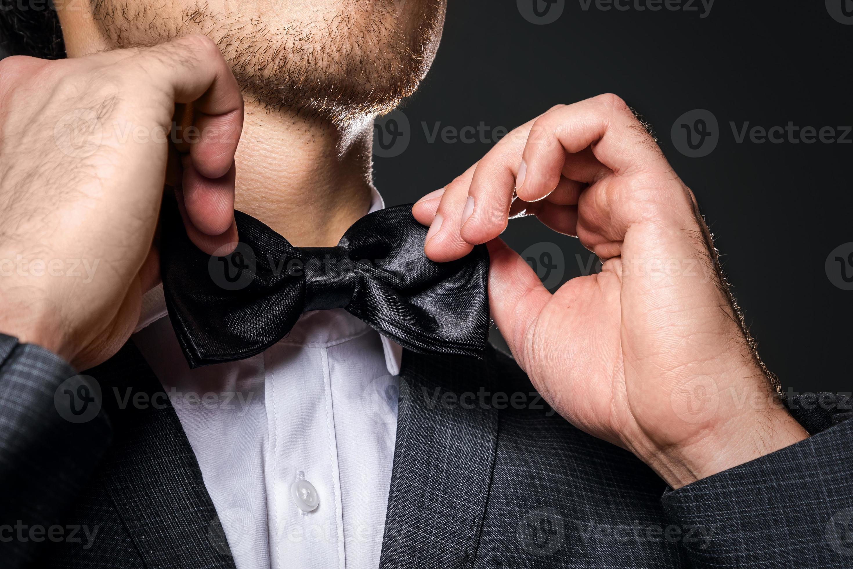 Man wearing bow tie 8862214 Stock Photo at Vecteezy