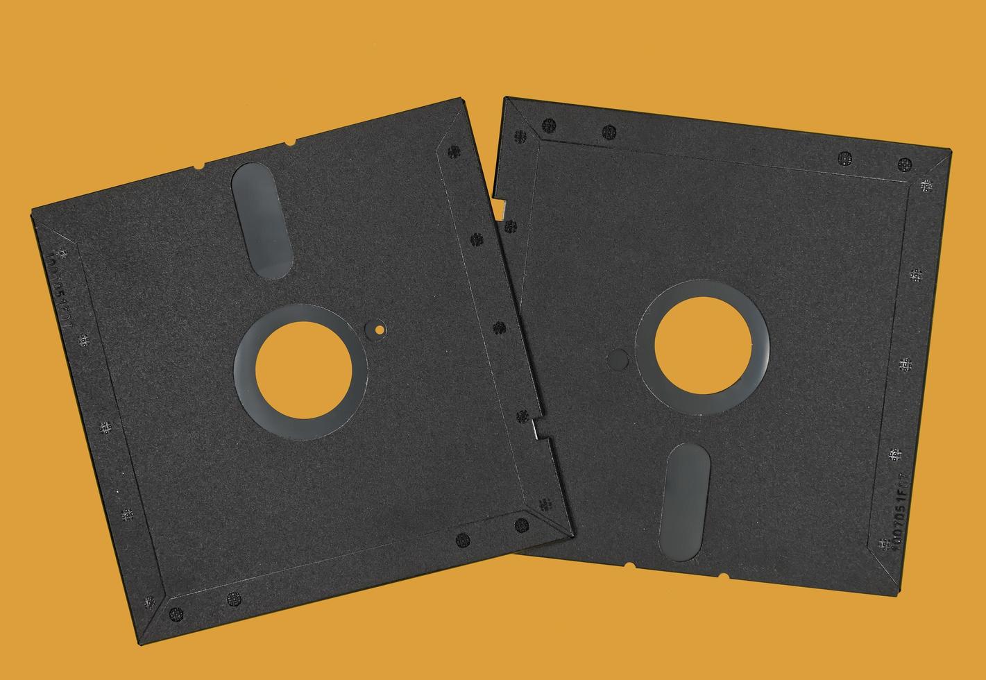 Vintage Floppy Disk 5.25 inch. Retro storage technology isolated on orange background. 8937791 ...