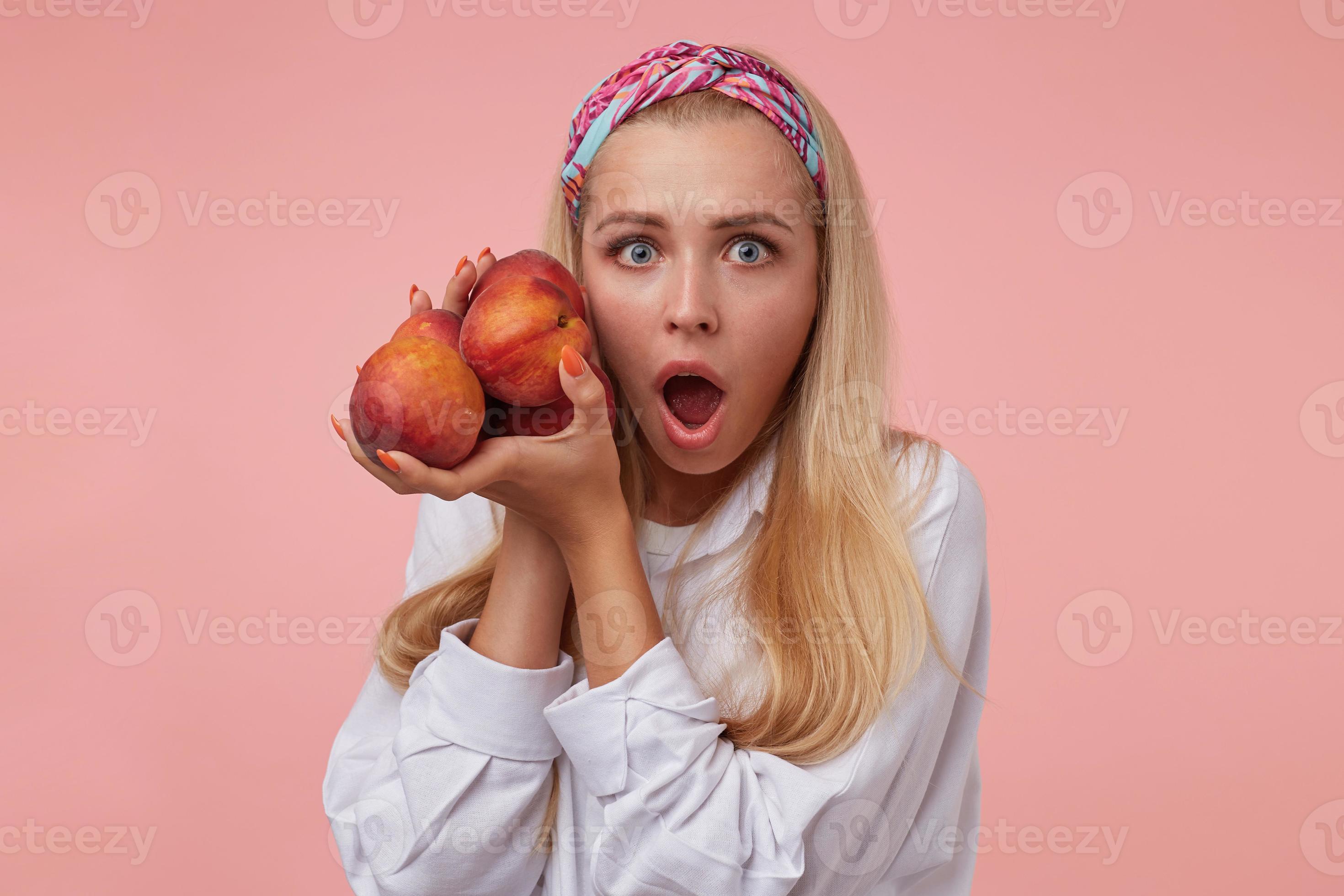 Shocked Pretty Female In White Shirt And Colored Shawl Standing Over