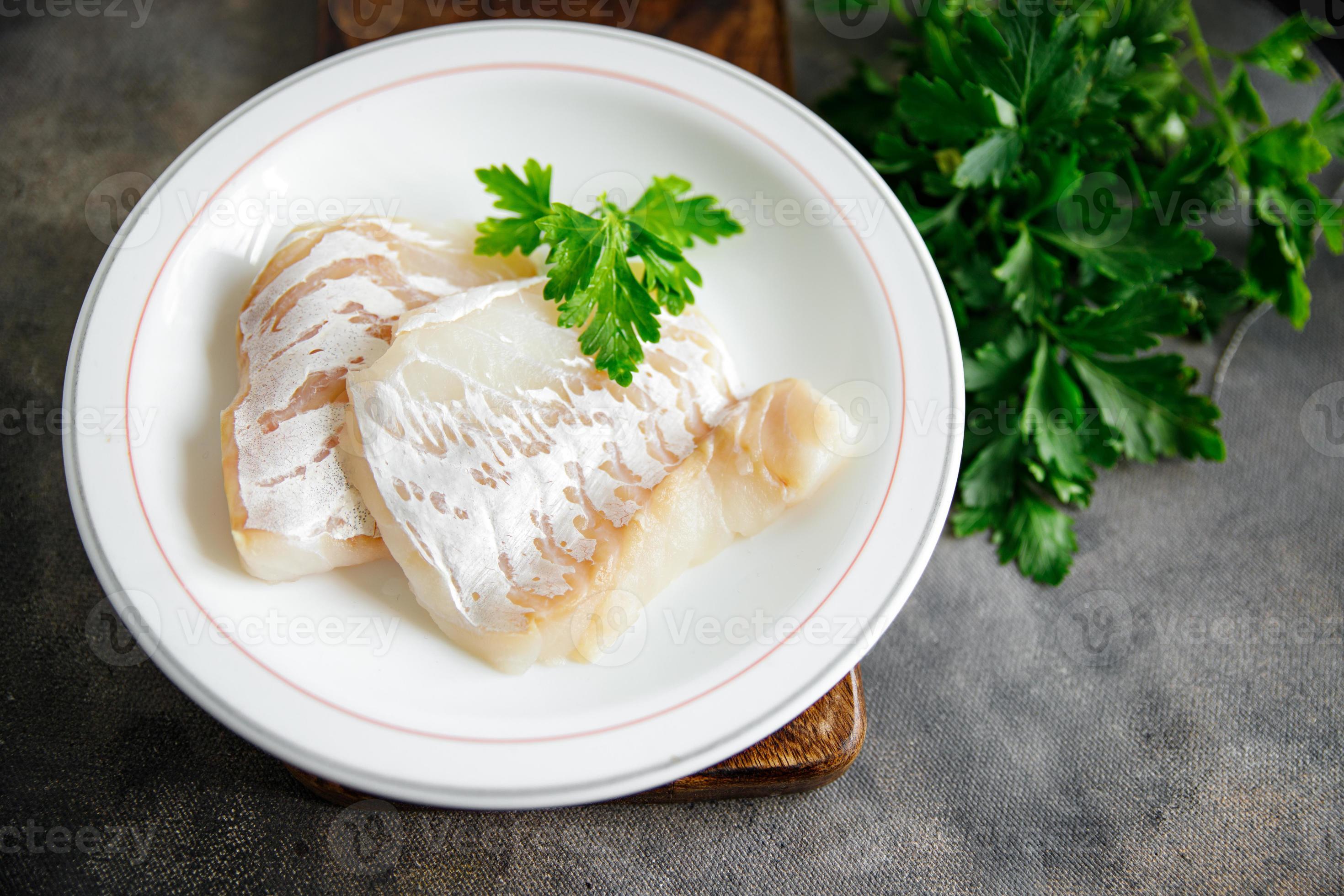 cod fish white skinless fillet fresh meal food snack on the table copy space food background ...