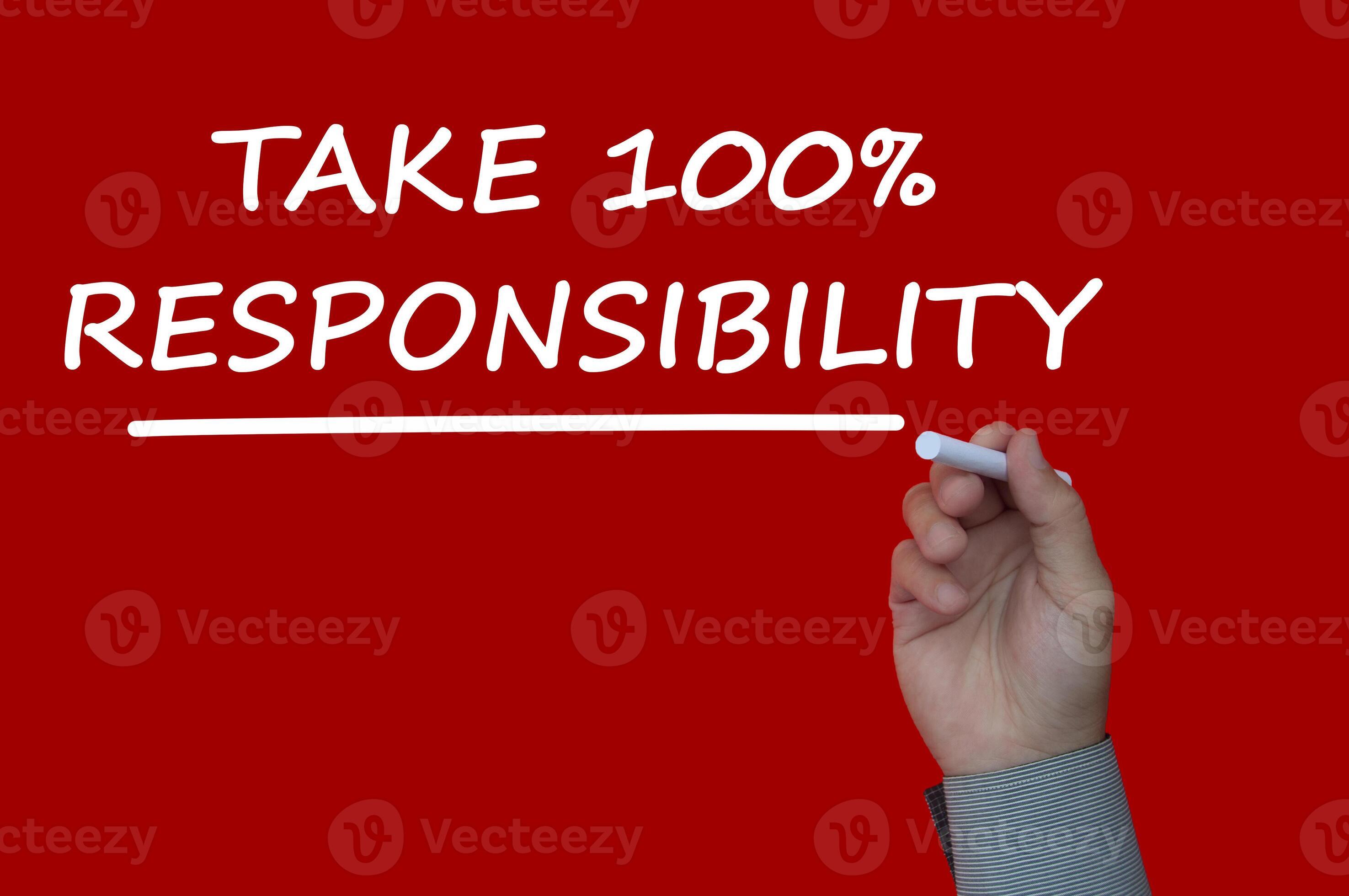 Take 100 percent responsibility reminder note written on a red cover ... Take 100 percent responsibility reminder note written on a red cover ...