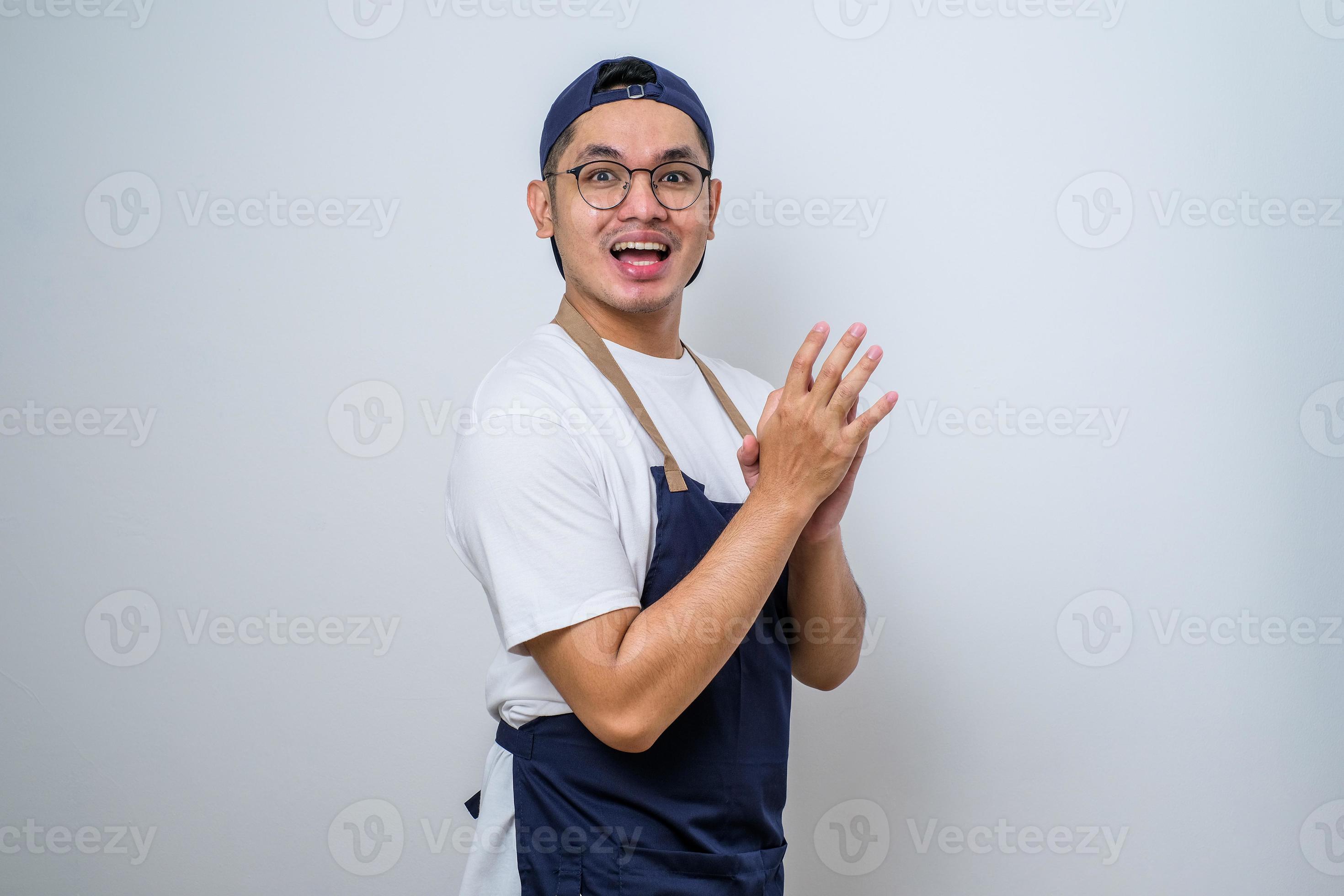 Young Asian Barista Man Wearing Apron Clapping And Applausing Happy And