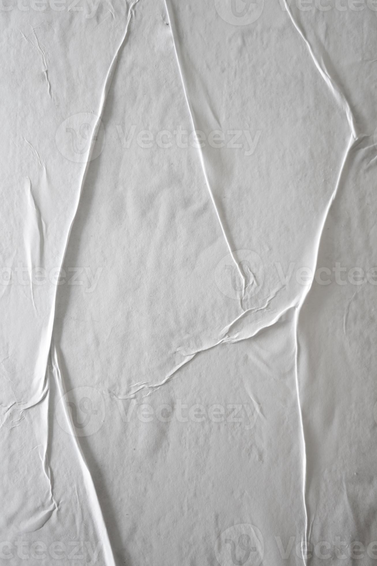 Blank white glued paper for poster texture overlay. Crumpled and ...