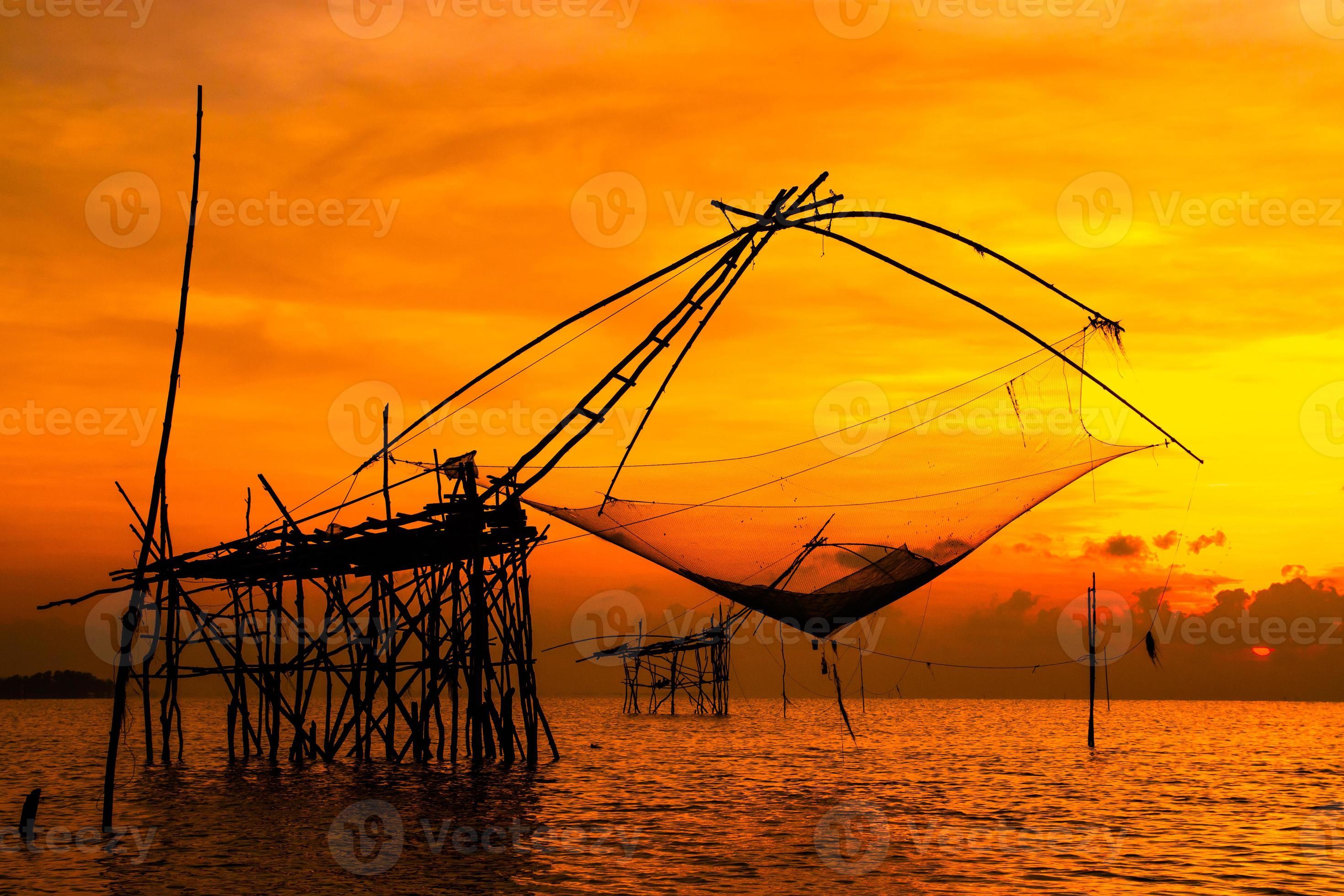 Landscape of square dip net made of bamboo in morning at Ban Pak Pra -Talay Noi Lake ...