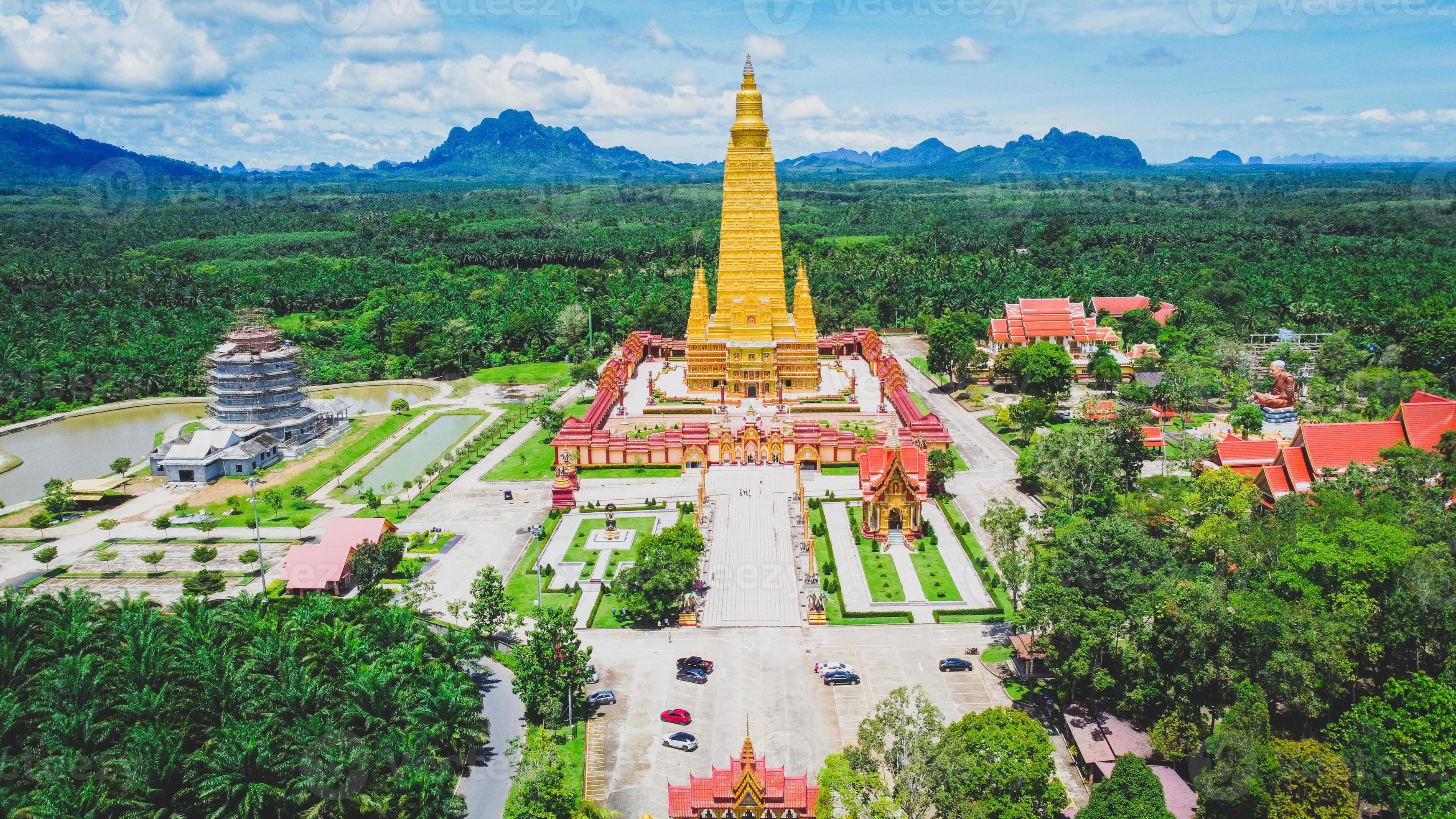An aerial view of a large temple in Thailand that is beautiful and is a very popular tourist ...