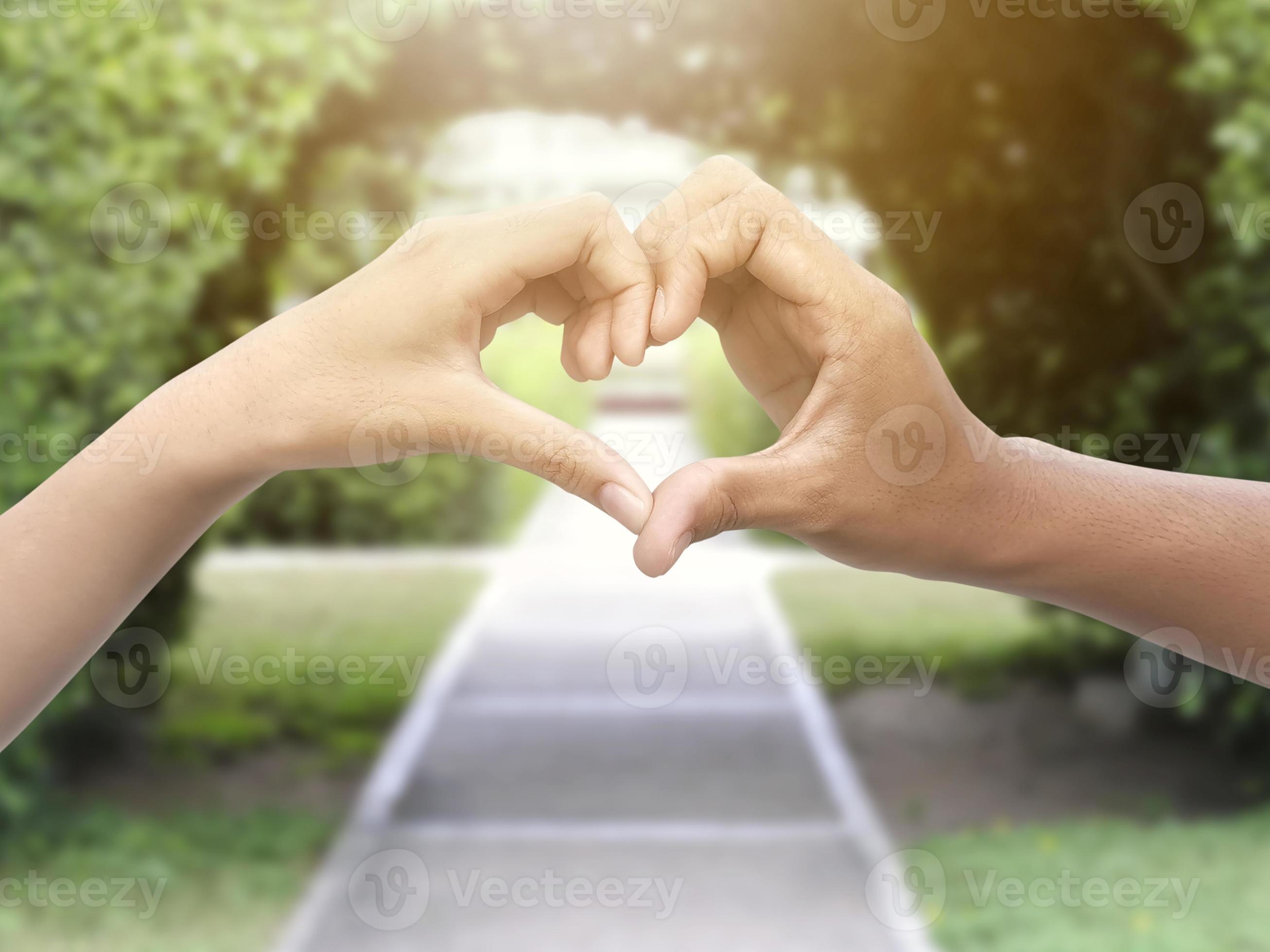 couple making heart shape with hands in park 10220292 Stock Photo at ... couple making heart shape with hands in park 10220292 Stock Photo at ...