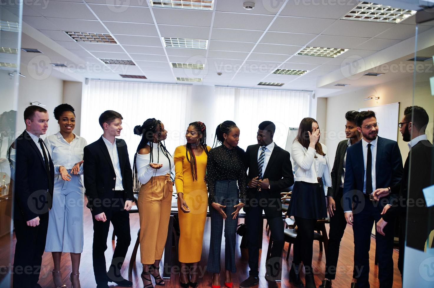 Large Group Of Eleven Multiracial Business People Standing At Office