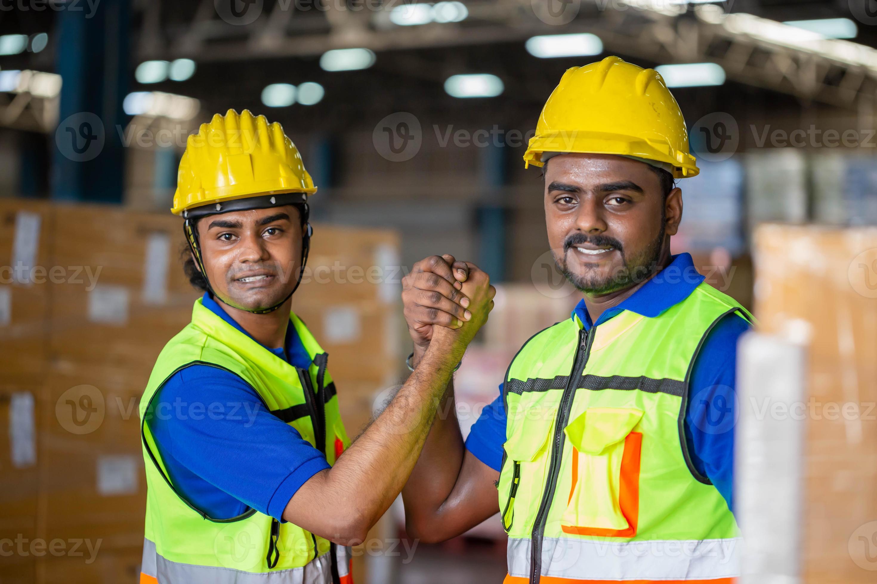 Workers man soul brother handshake, thumb clasp handshake or homie handshake with blurred ...