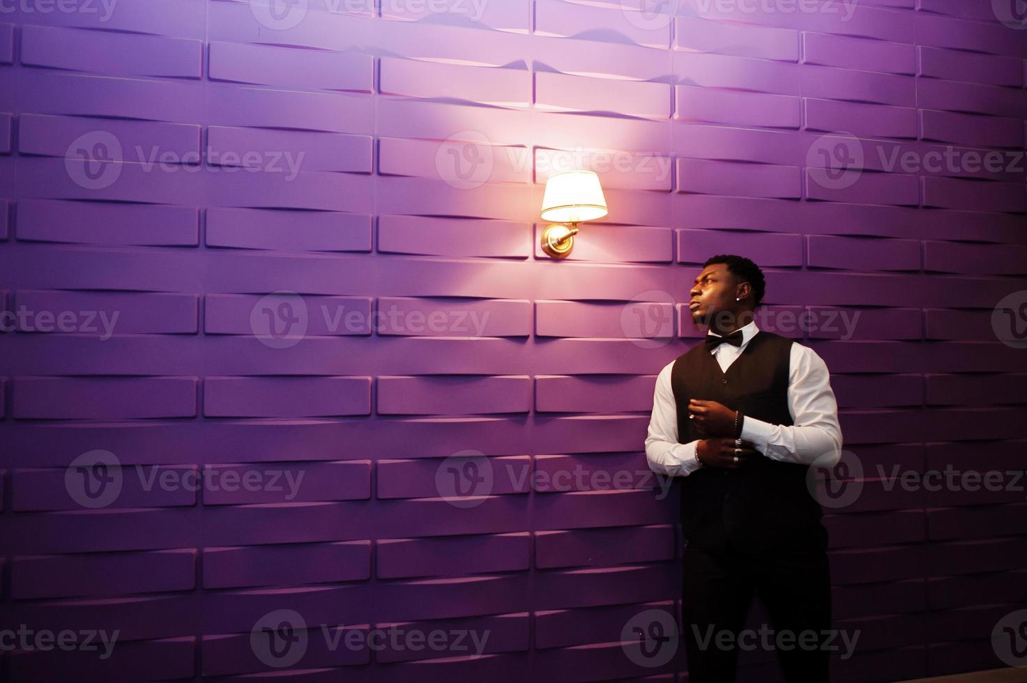 Young Handsome African Man Wearing White Shirt Black Vest And Bow Tie