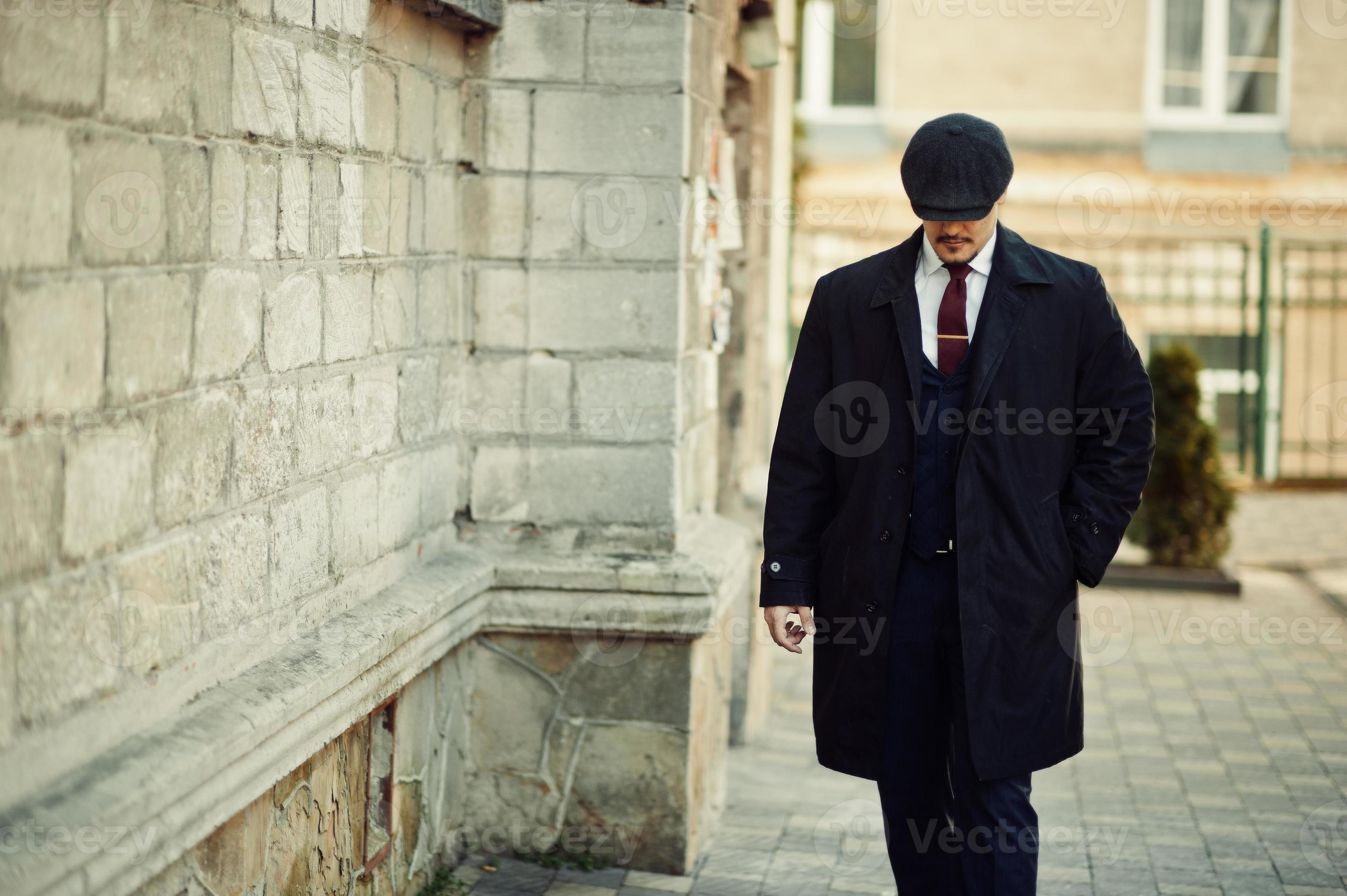 Portrait of retro 1920s english arabian business man wearing dark coat ...
