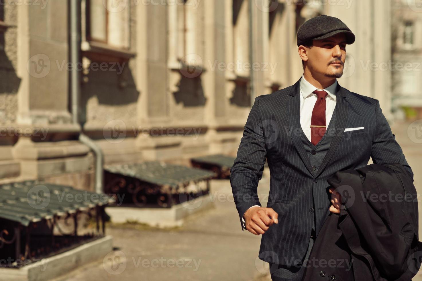 Portrait of retro 1920s english arabian business man wearing dark suit ...