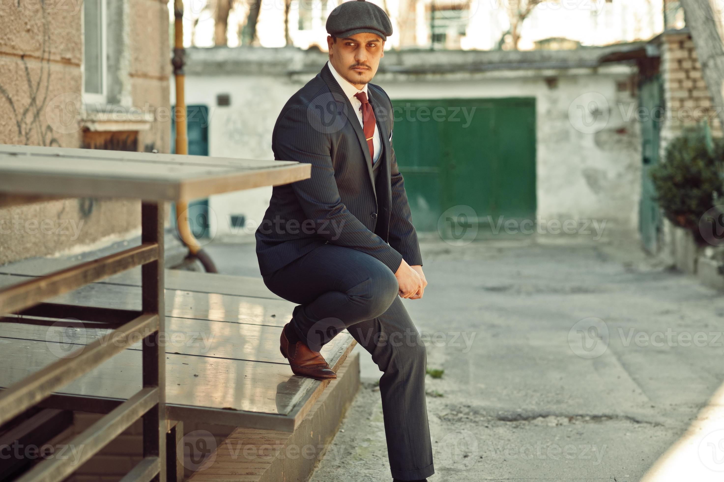Portrait of retro 1920s english arabian business man wearing dark suit ...