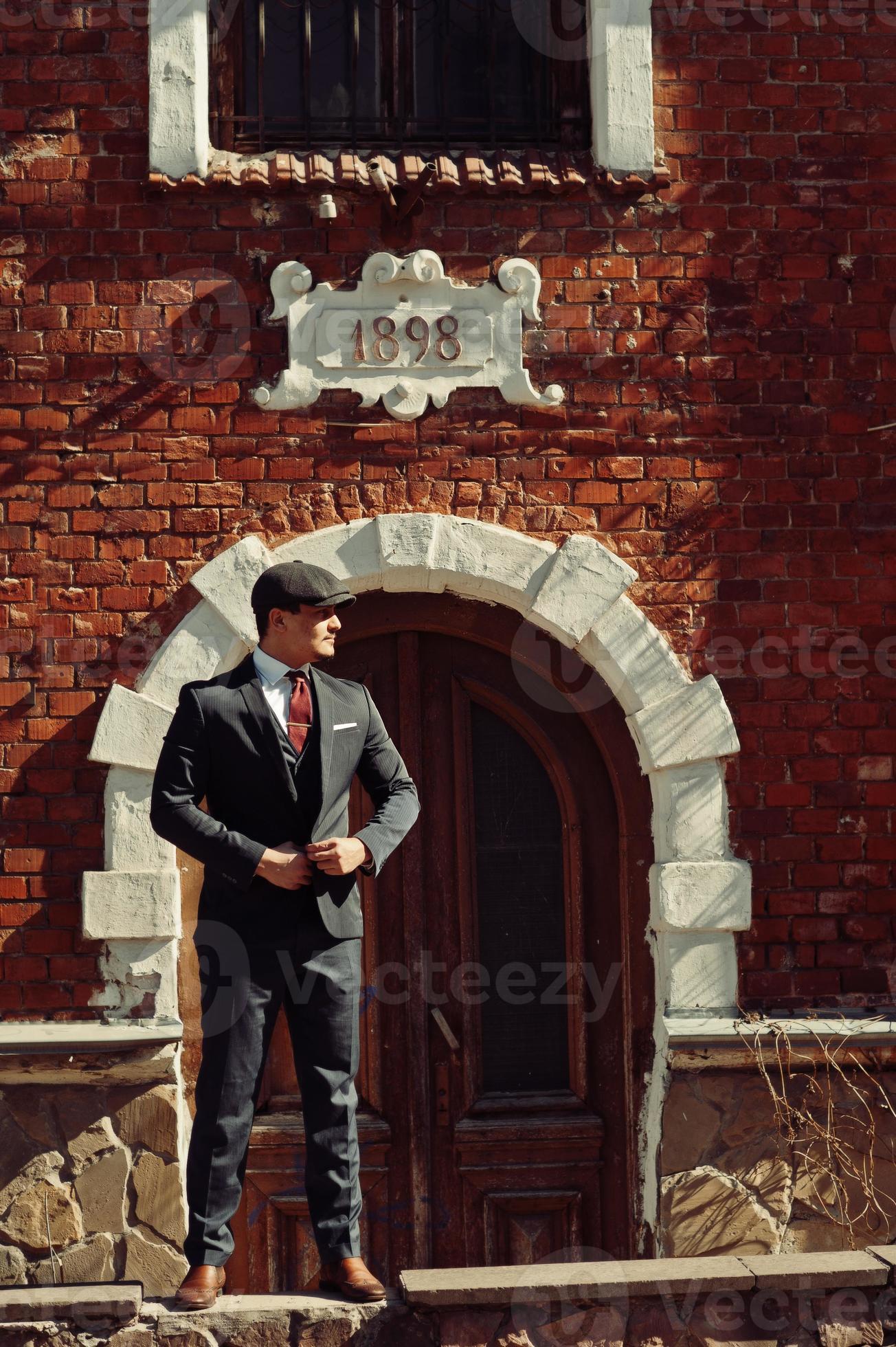 Portrait of retro 1920s english arabian business man wearing dark suit ...
