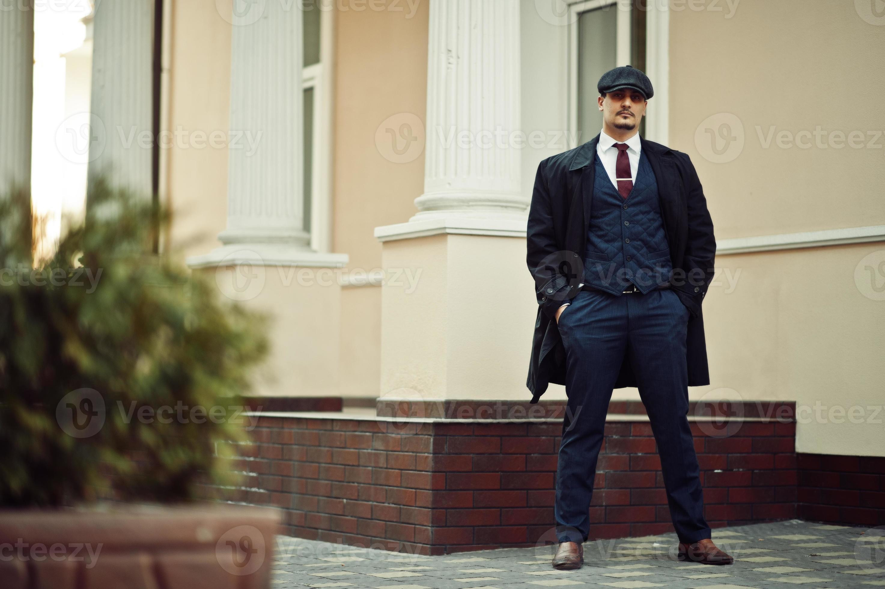 Portrait of retro 1920s english arabian business man wearing dark coat ...