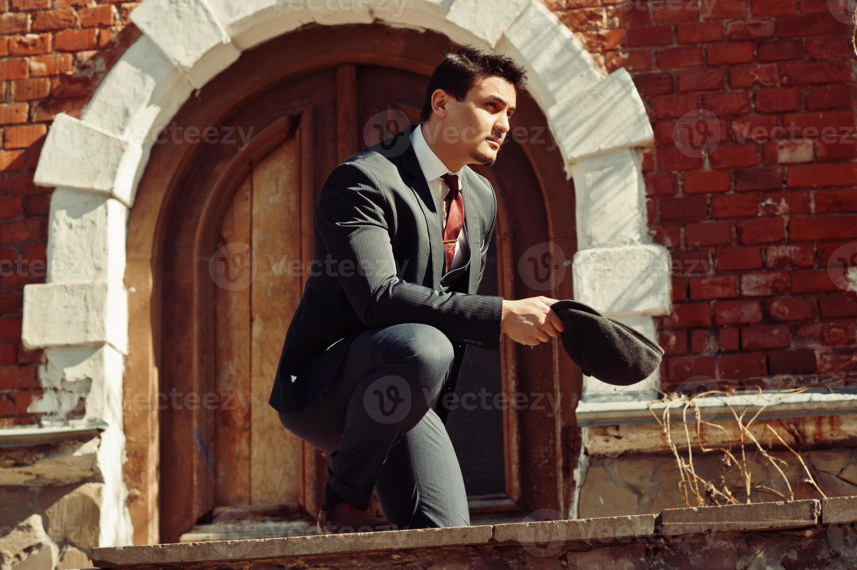 Portrait of retro 1920s english arabian business man wearing dark suit ...