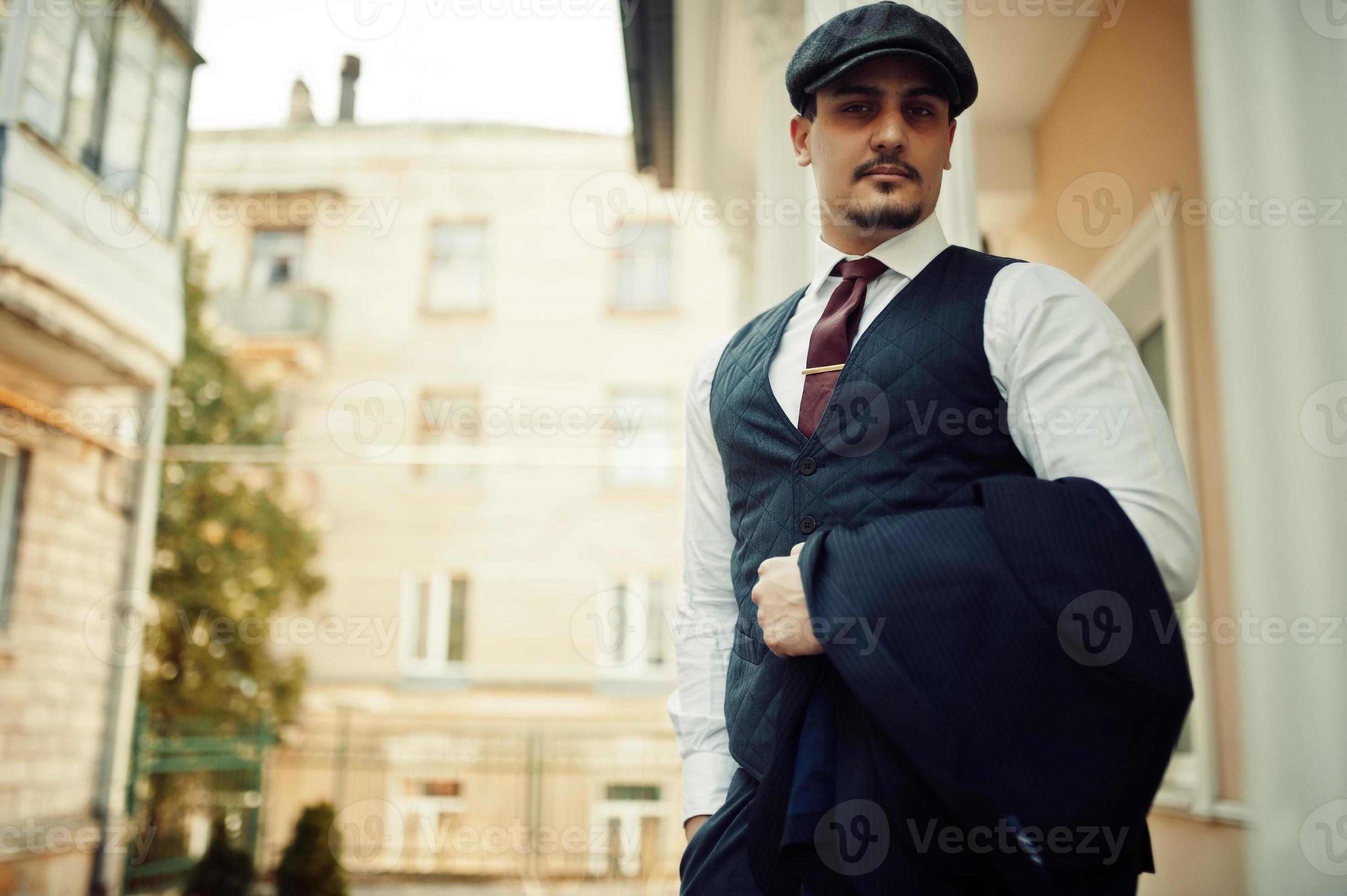 Portrait of retro 1920s english arabian business man wearing dark suit ...