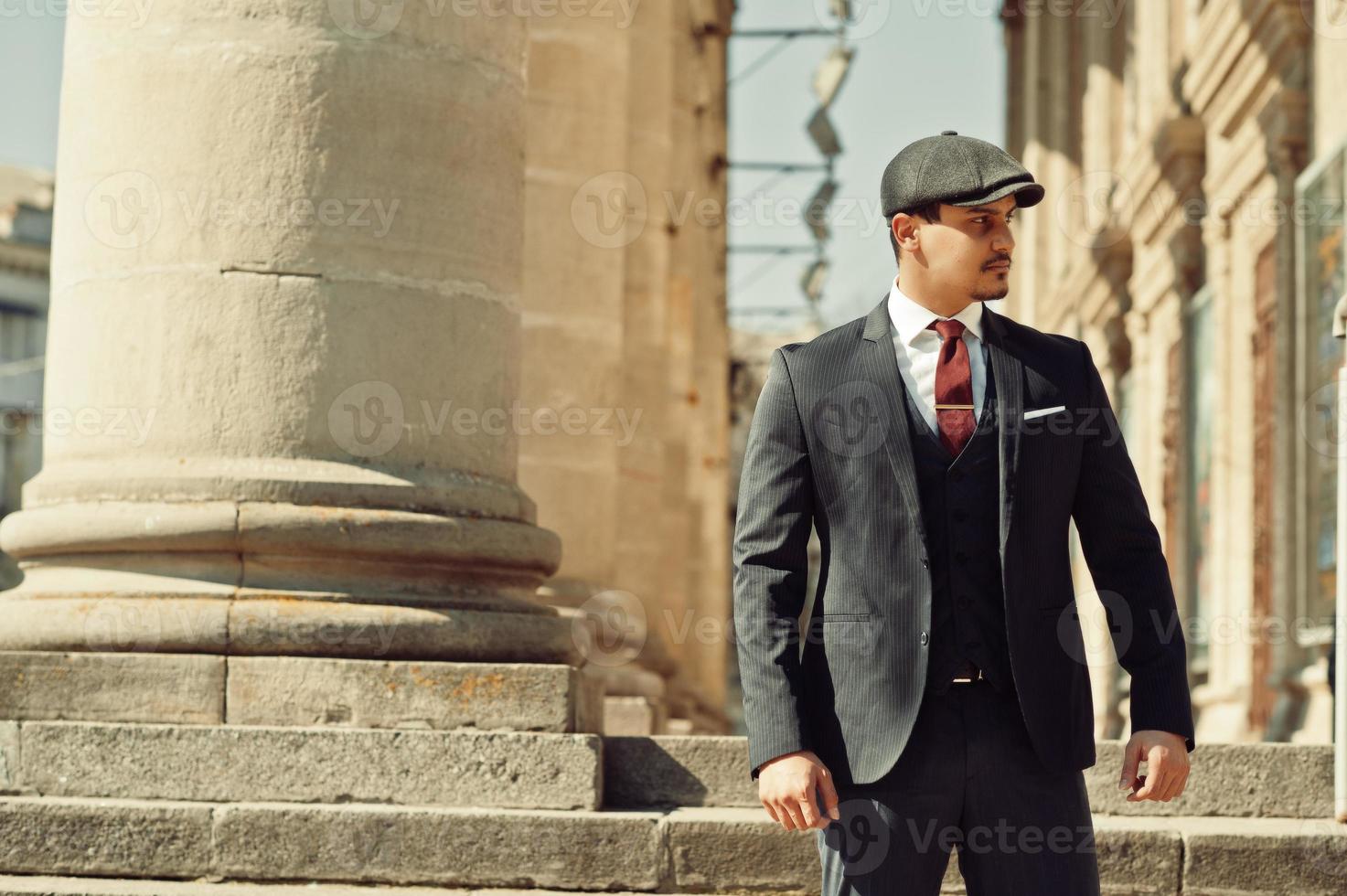Portrait of retro 1920s english arabian business man wearing dark suit ...