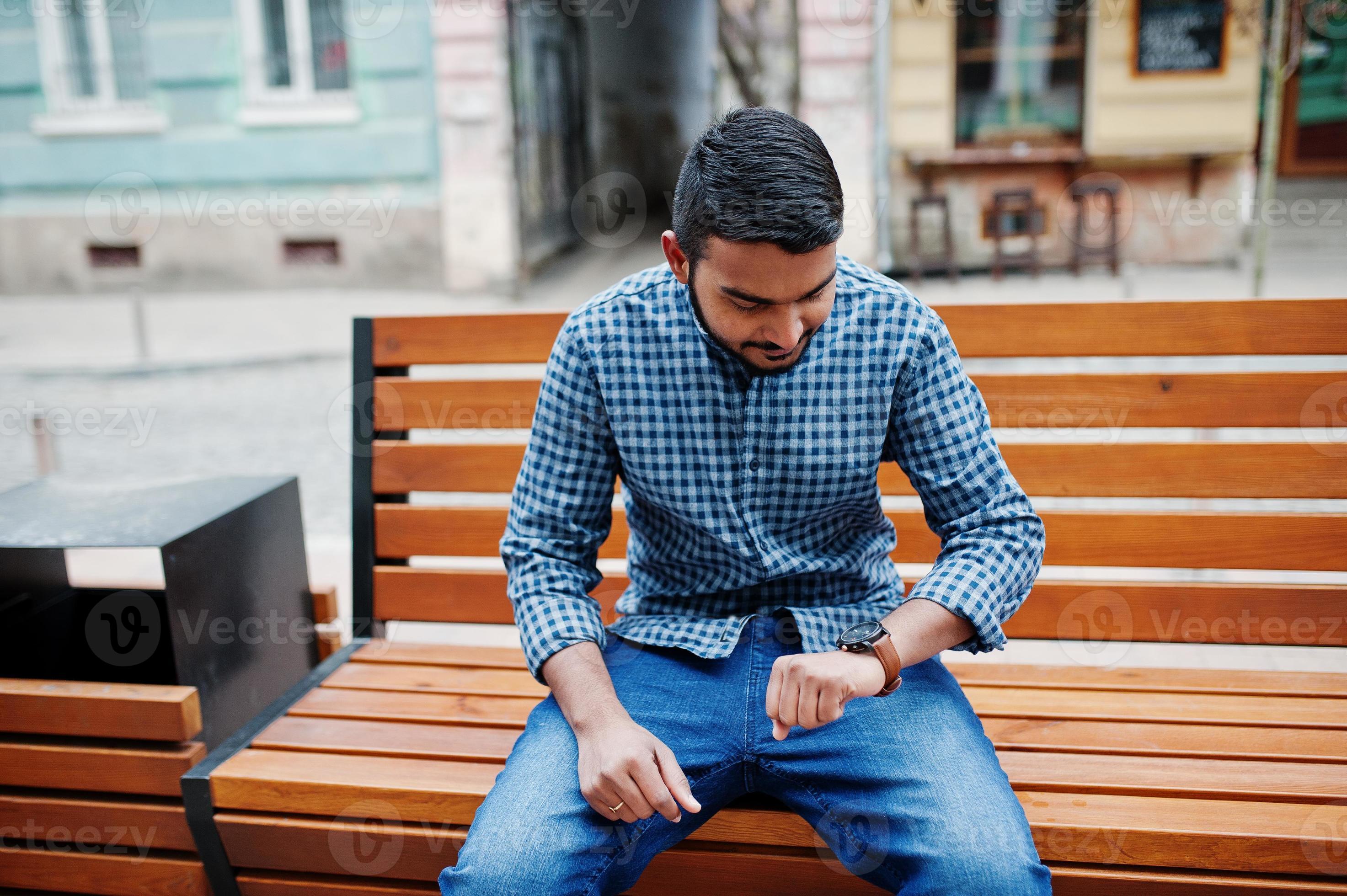 Stylish indian beard model man in casual clothes posed outdoor, sitting ...