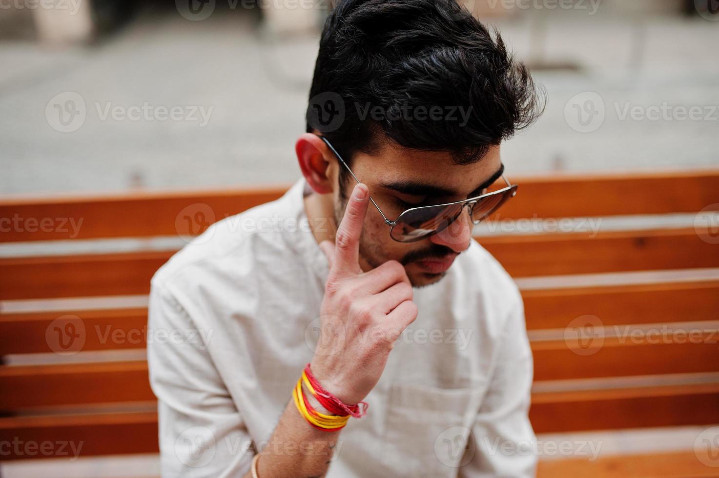 Stylish indian model man in casual clothes and sunglasses posed outdoor ... Stylish indian model man in casual clothes and sunglasses posed outdoor ...