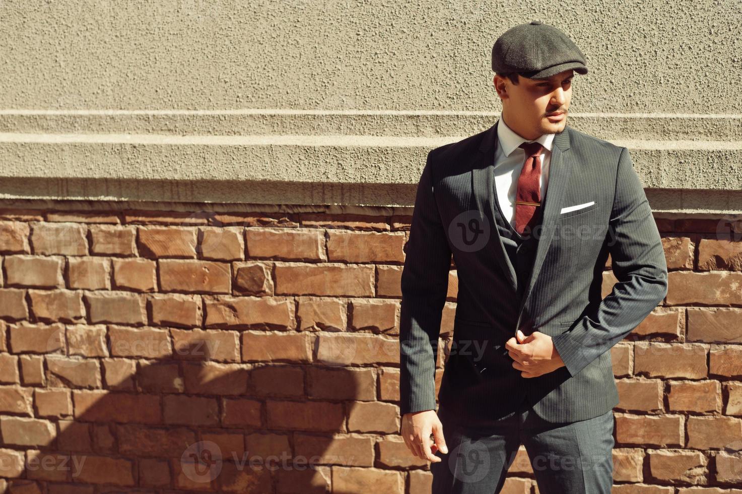 Portrait of retro 1920s english arabian business man wearing dark suit ...