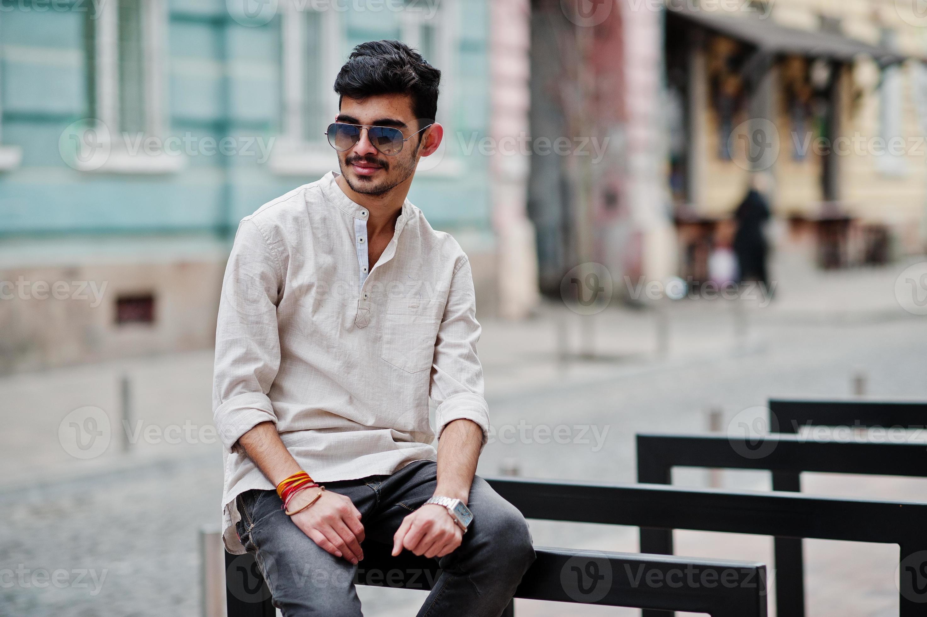 Stylish indian model man in casual clothes and sunglasses posed outdoor ... Stylish indian model man in casual clothes and sunglasses posed outdoor ...