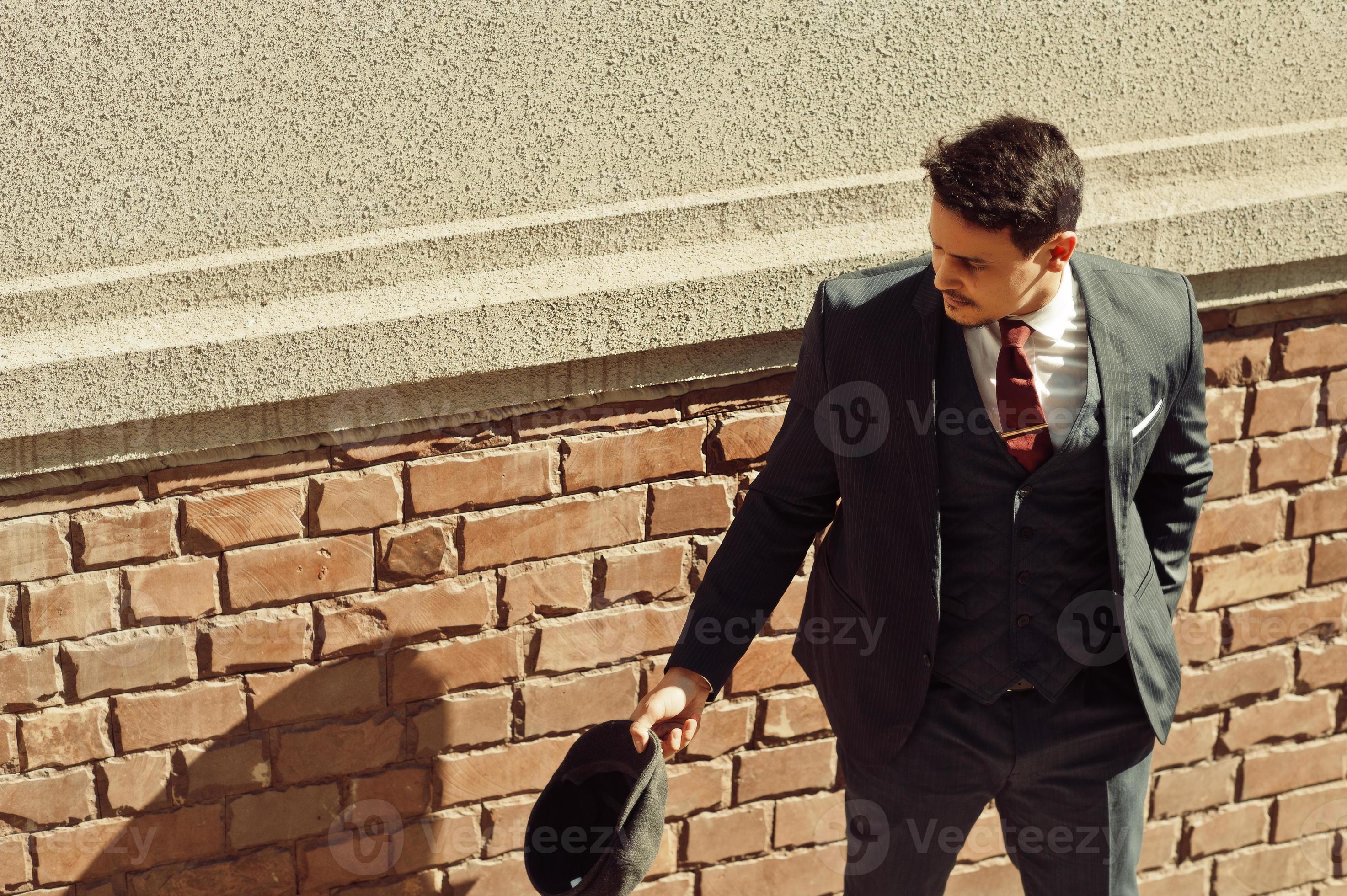 Portrait of retro 1920s english arabian business man wearing dark suit ...