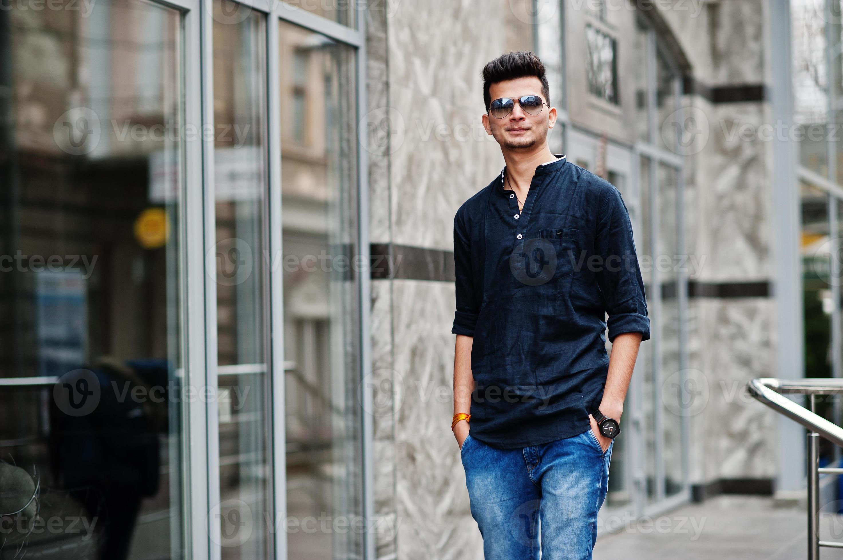 Stylish indian model man in casual clothes and sunglasses posed outdoor ... Stylish indian model man in casual clothes and sunglasses posed outdoor ...