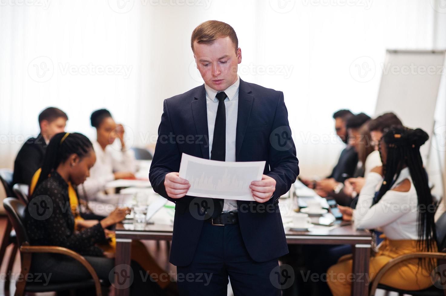 Face of handsome european business man, holding paper with diagram on ...