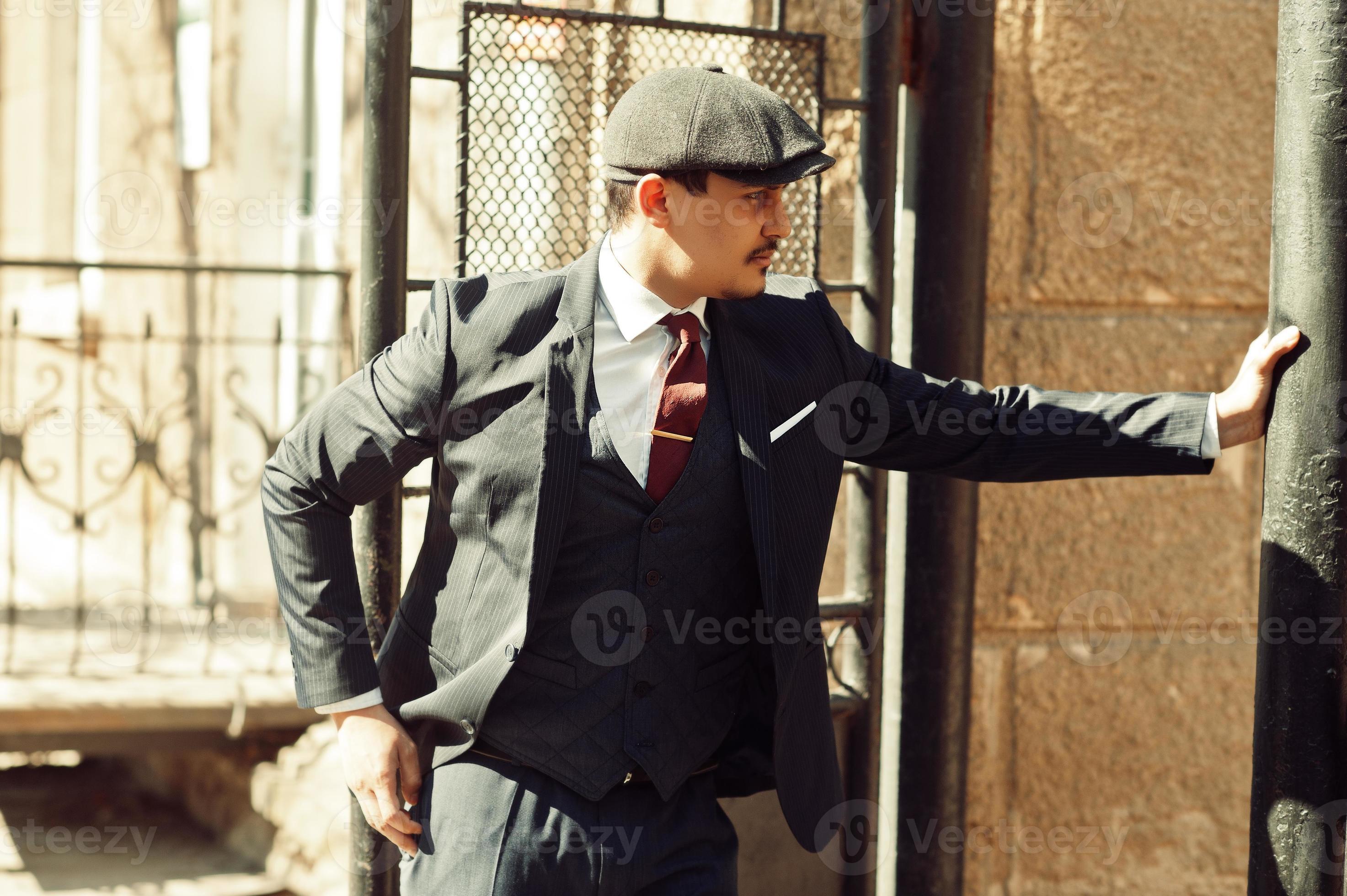 Portrait of retro 1920s english arabian business man wearing dark suit ...