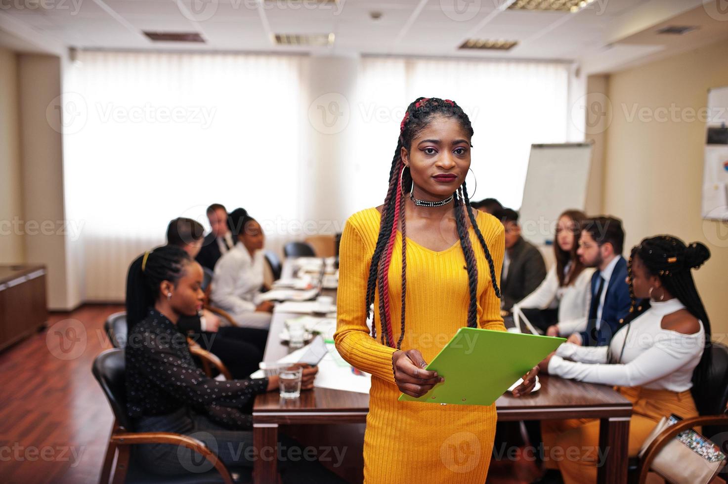 Face Of Handsome African Business Woman In Yellow Dress Holding