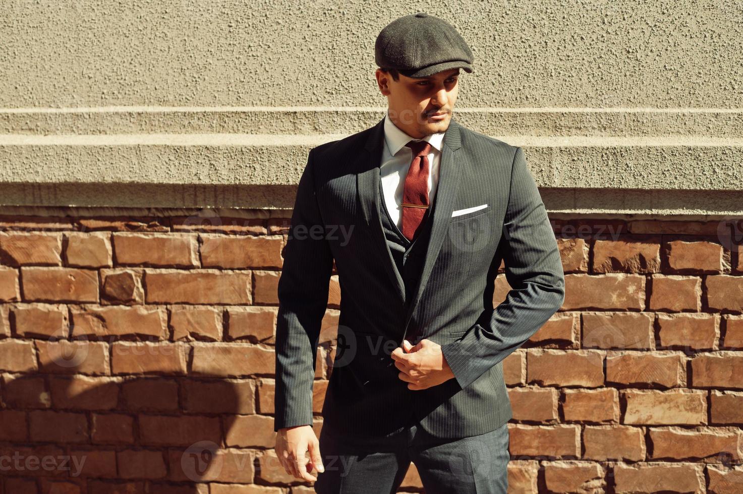 Portrait of retro 1920s english arabian business man wearing dark suit ...