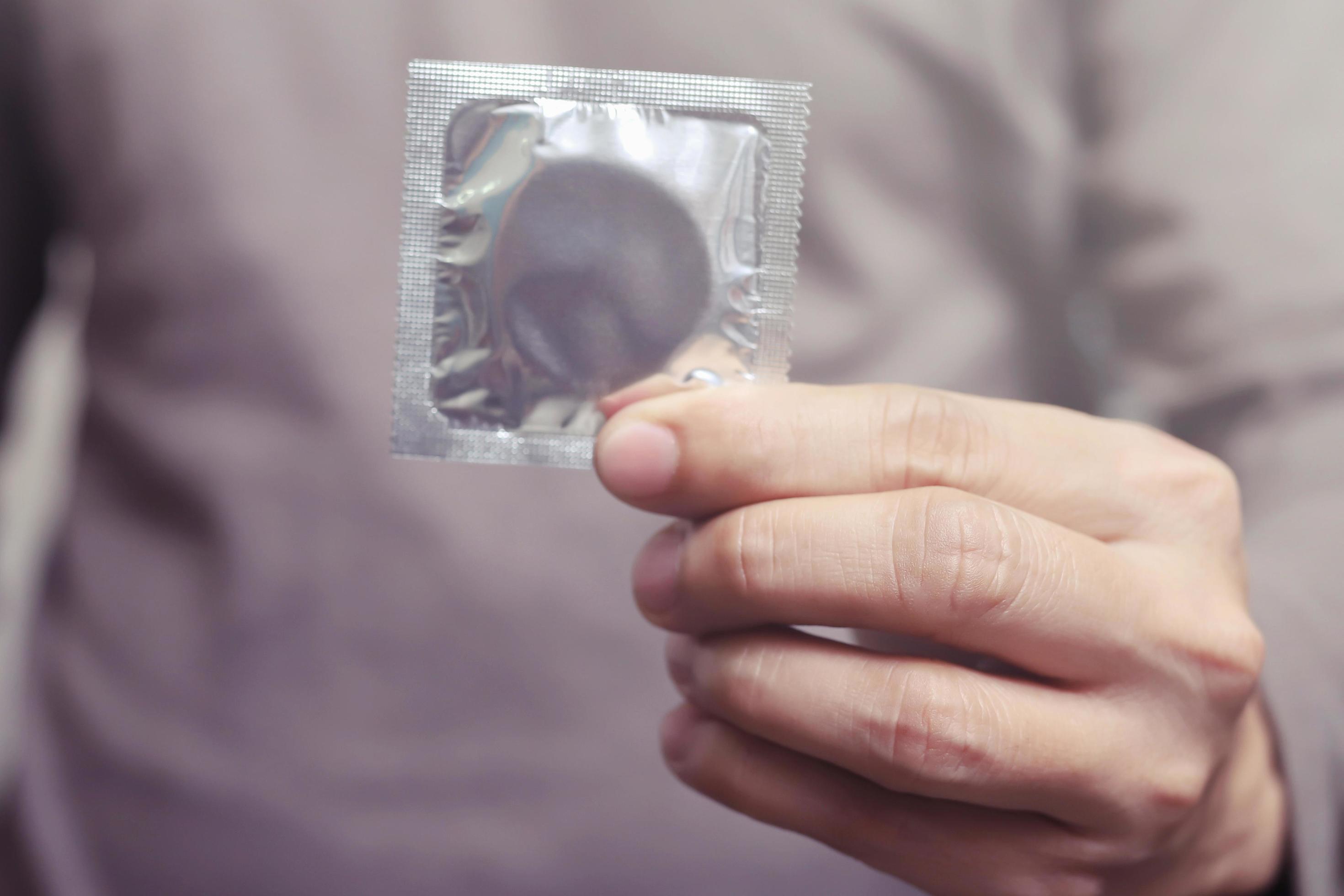 Condoms Ready To Use In Female Hand Give Condom Safe Sex Concept On