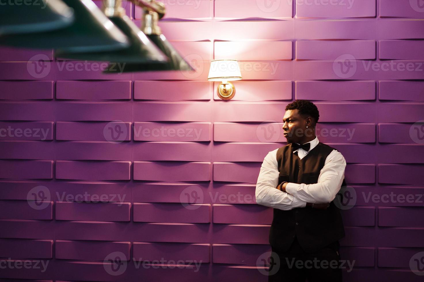 Young Handsome African Man Wearing White Shirt Black Vest And Bow Tie