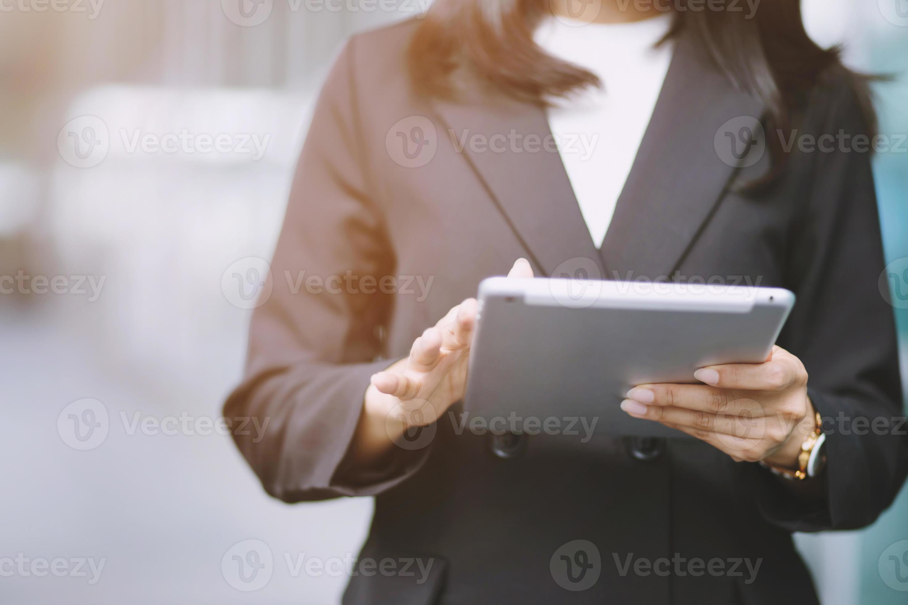 close up hand business woman working using a digital tablet pc device ...