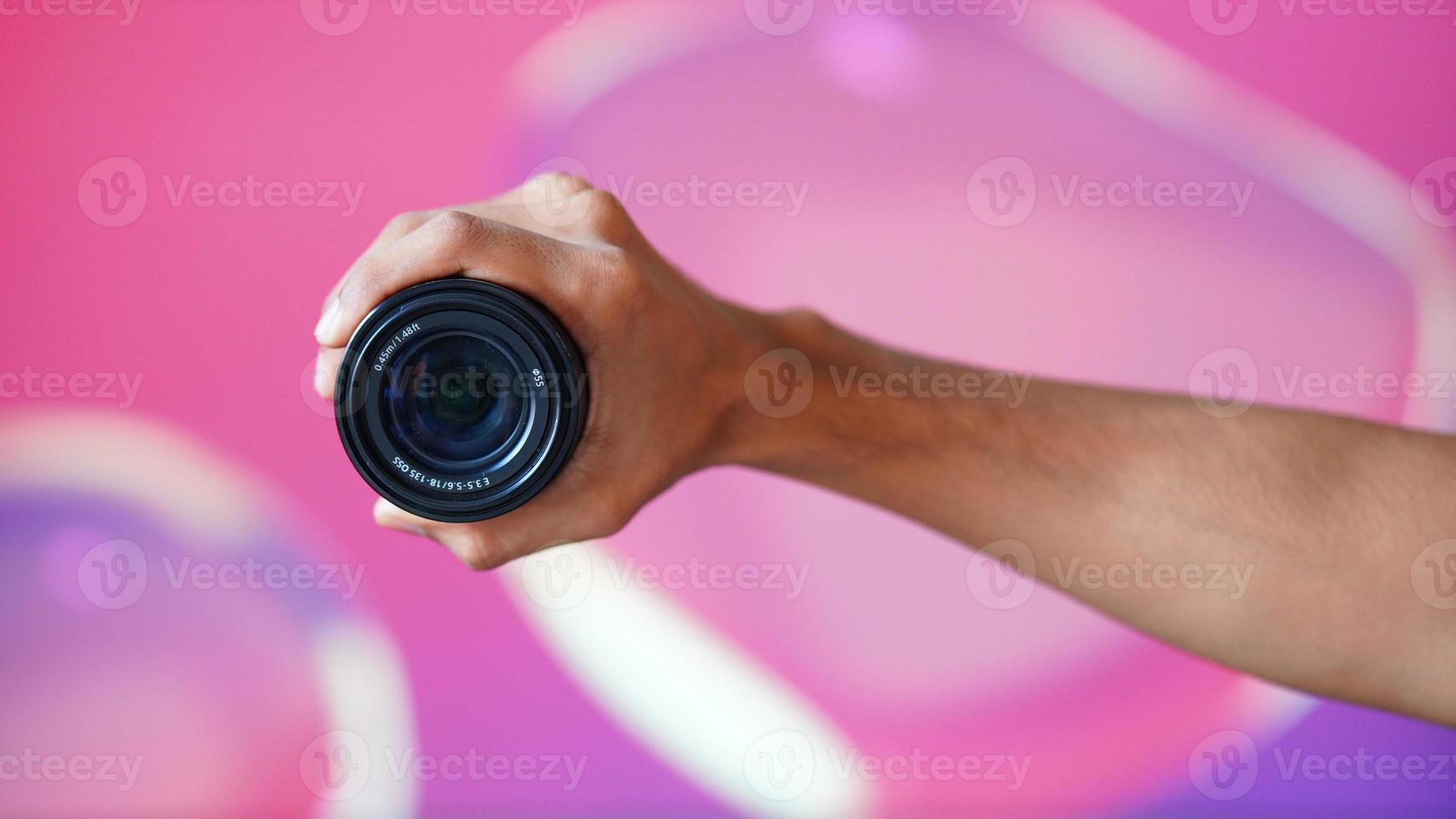 front image of a camera lens with pink background. 10601625 Stock Photo ...